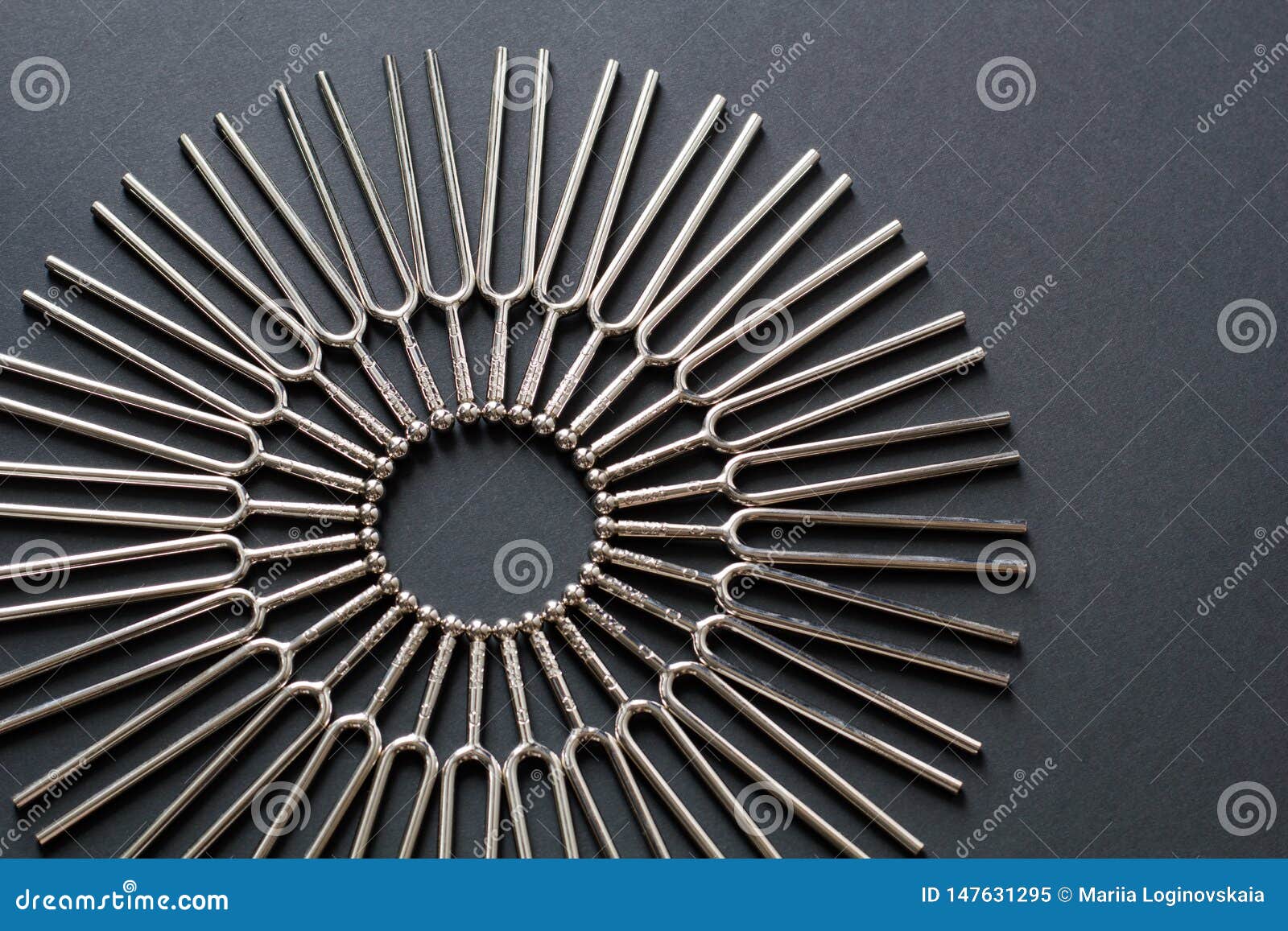 Tuning Fork Circular Pattern on a Black Background with Copy Space ...