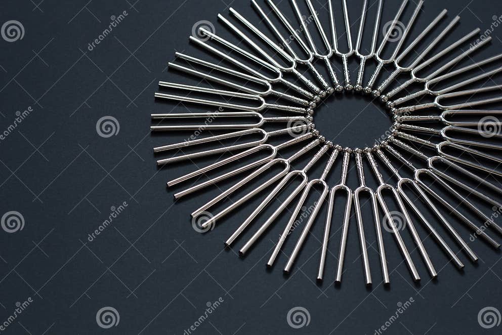 Tuning Fork Round Pattern on a Black Background Stock Image - Image of ...