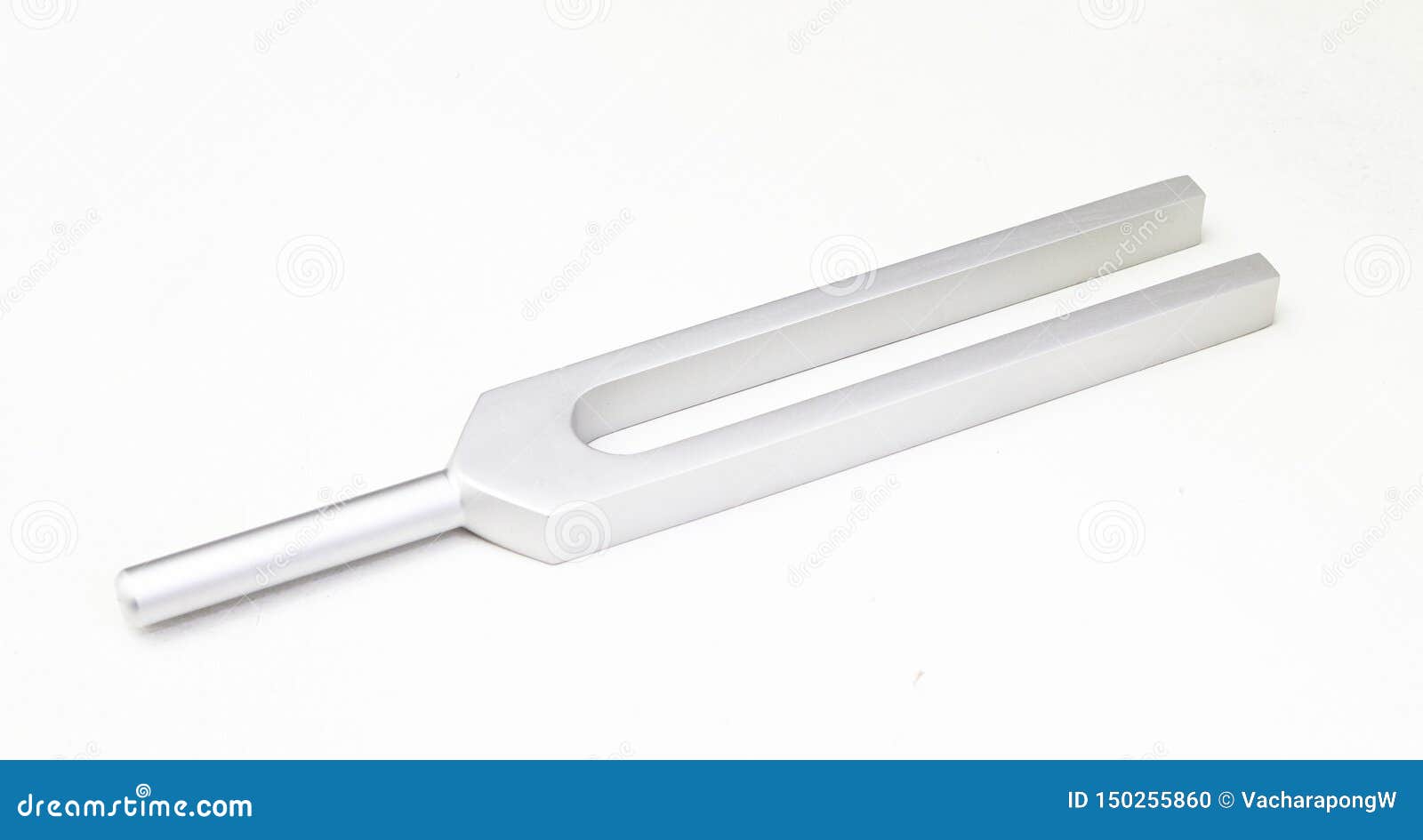 Tuning fork on white table stock photo. Image of high - 150255860