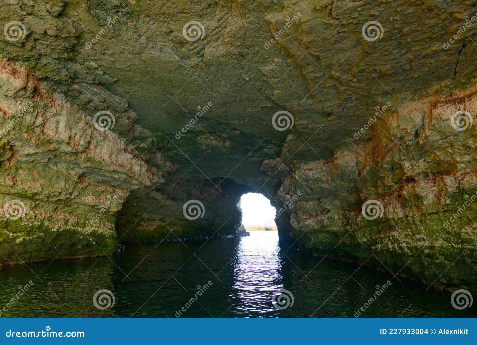 Tunnel in a Rock Above the Sea Surface Stock Photo - Image of color ...
