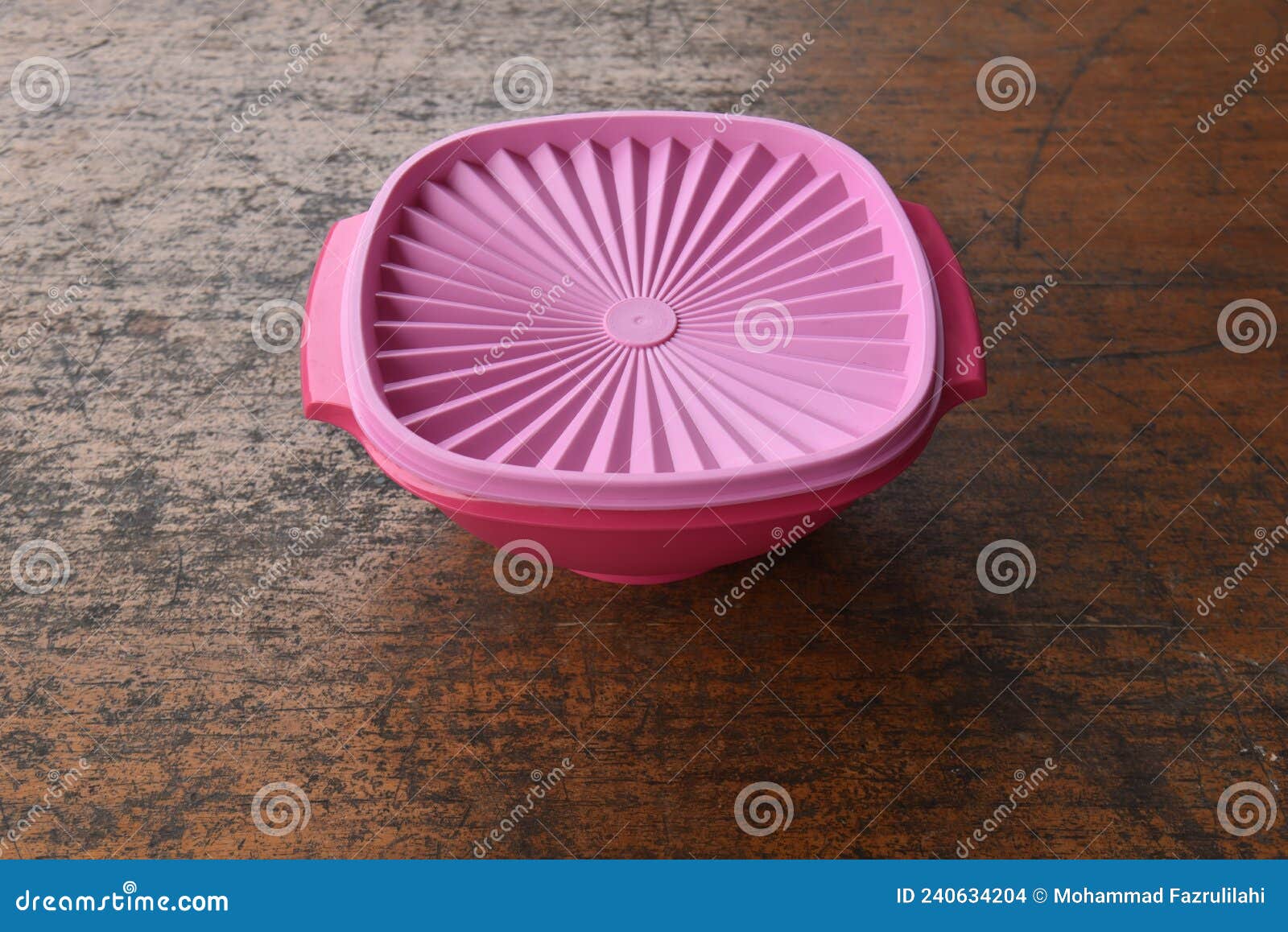 Tupperware Serving Set With Wood Table Background Stock Photo ...