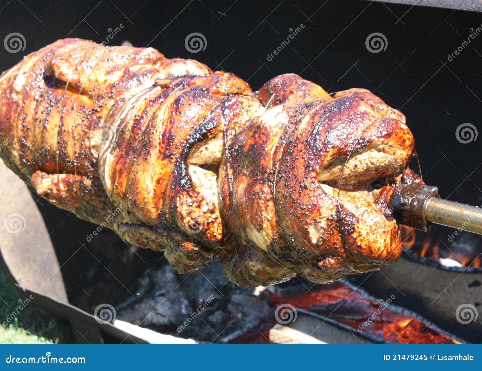 Turkeys roasting over fire stock image. Image of sizzle - 21479245