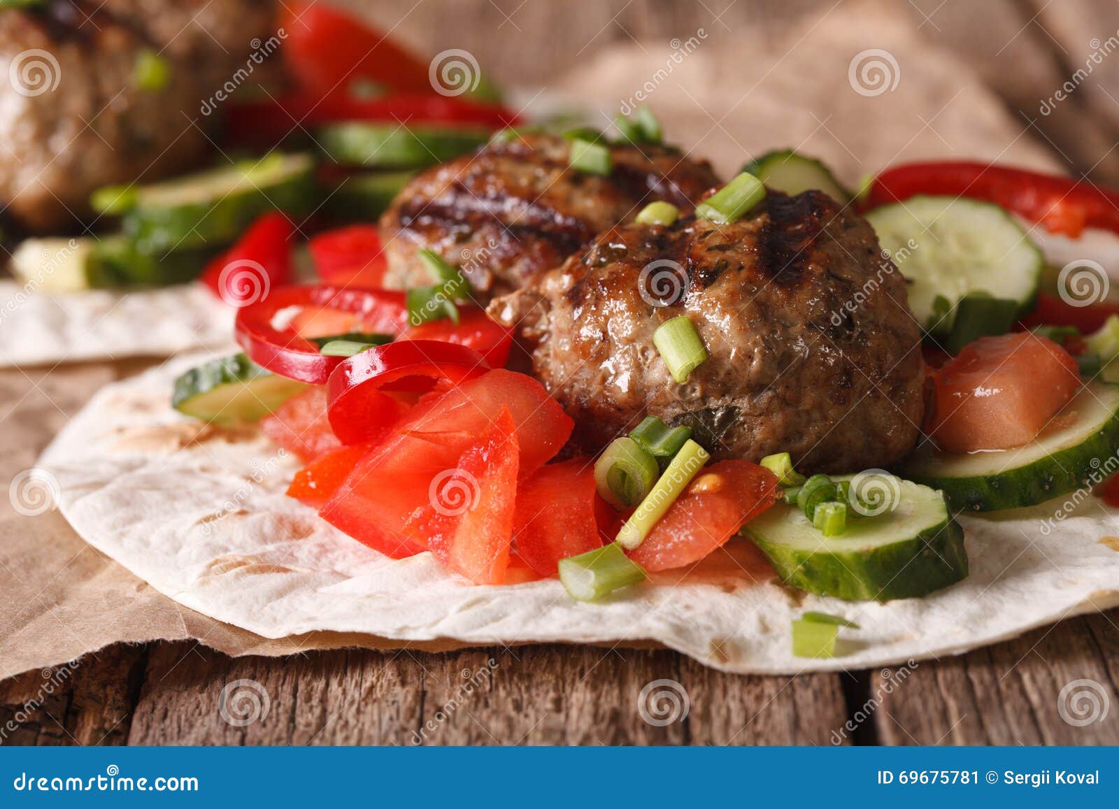 Turkish Kofta with Fresh Vegetables on a Flat Bread Close Up. Ho Stock ...