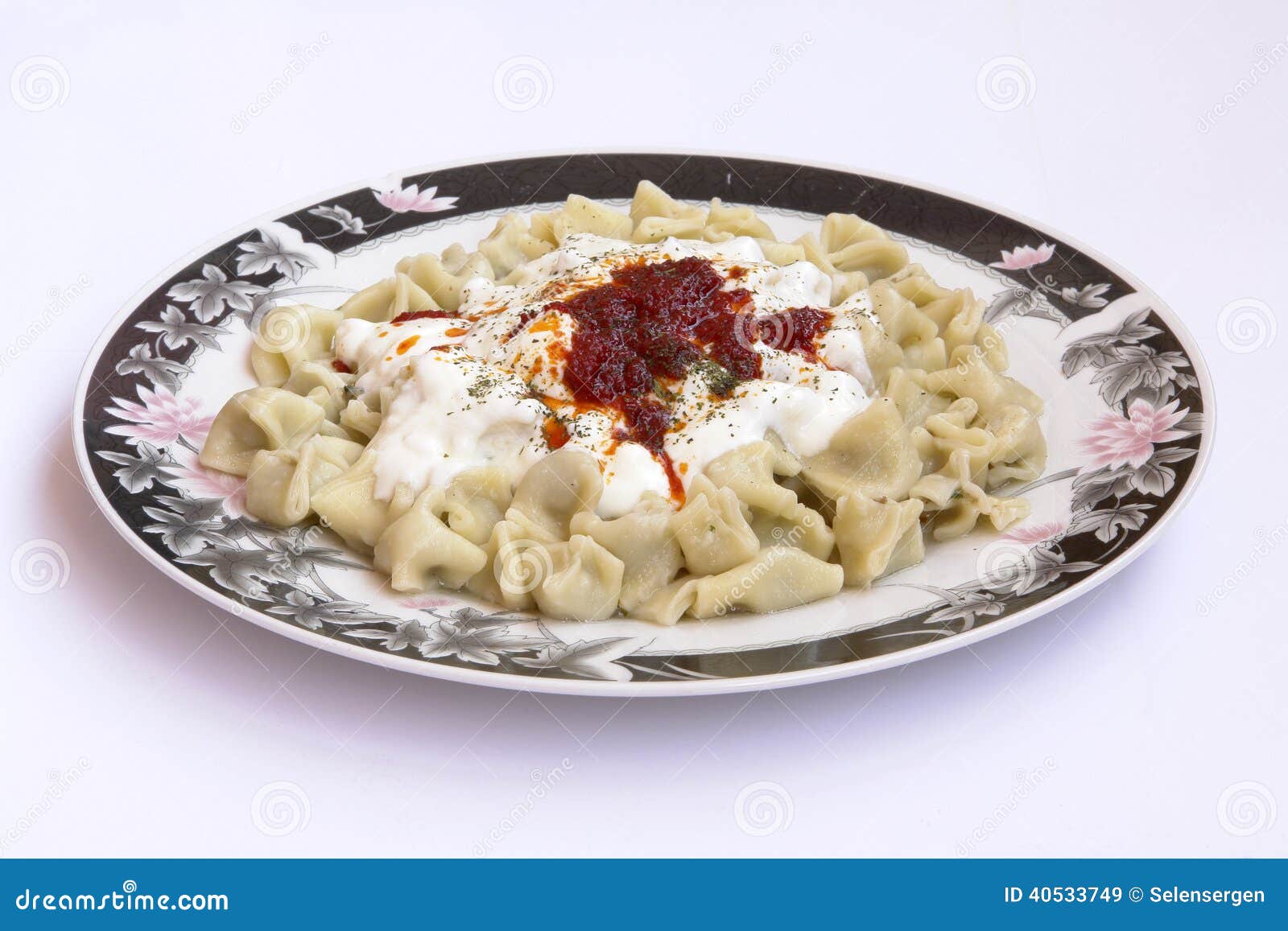 Turkish Manti With Red Pepper, Tomato Sauce, Yogurt And Mint. Plate Of ...