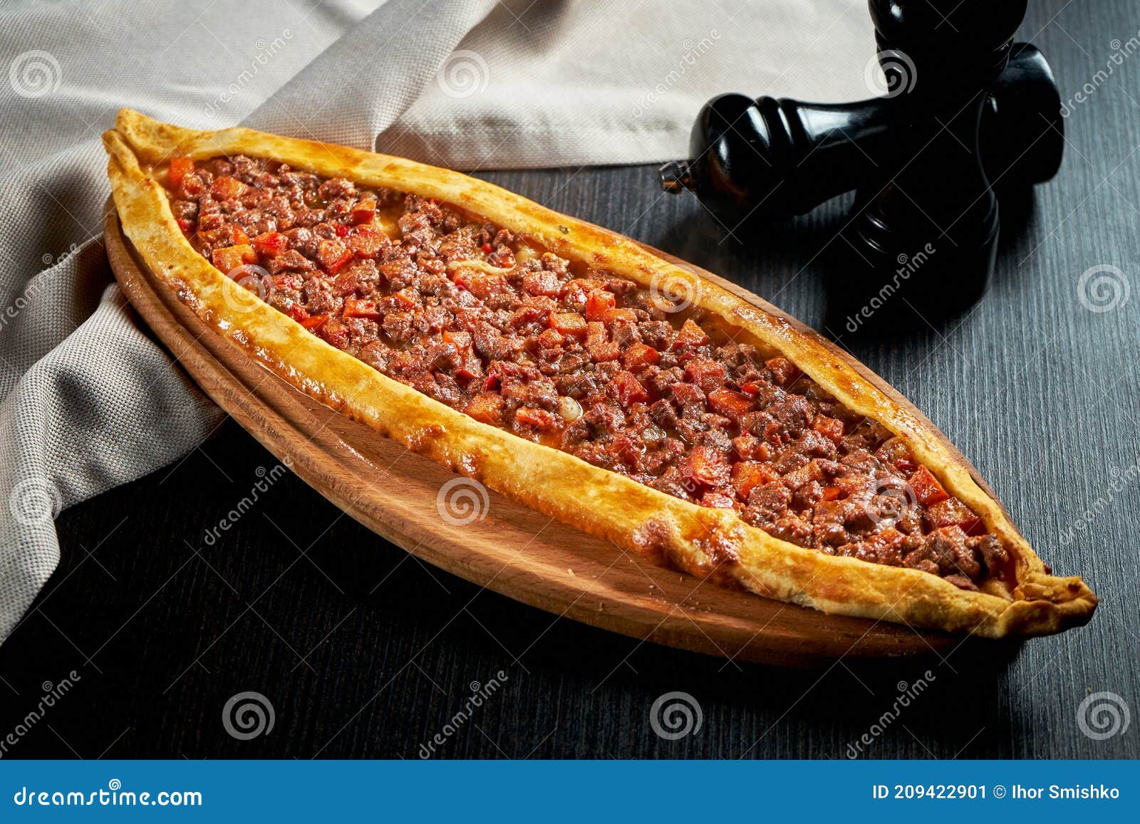 Turkish Pide Dish with Slices of Beef, Tomatoes on Black Background ...