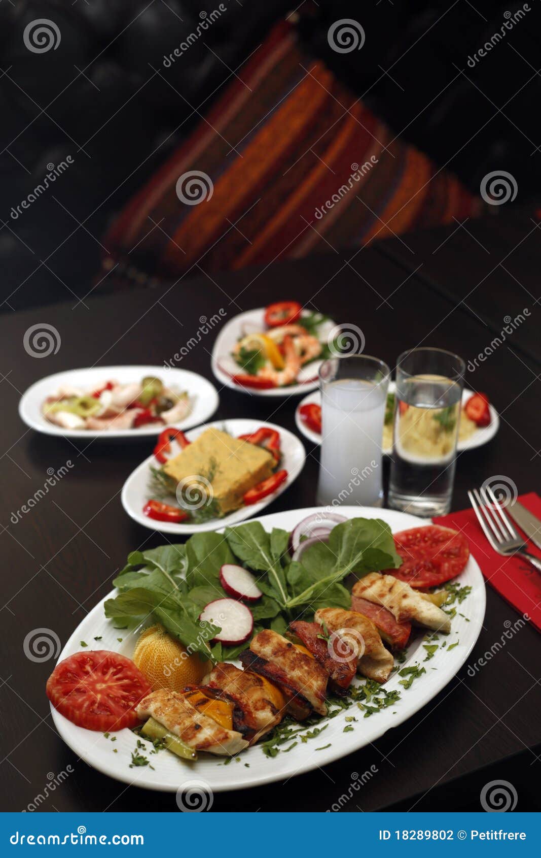 Turkish Raki And Roasted Bonito Fish With Appetizers On The Table Stock ...