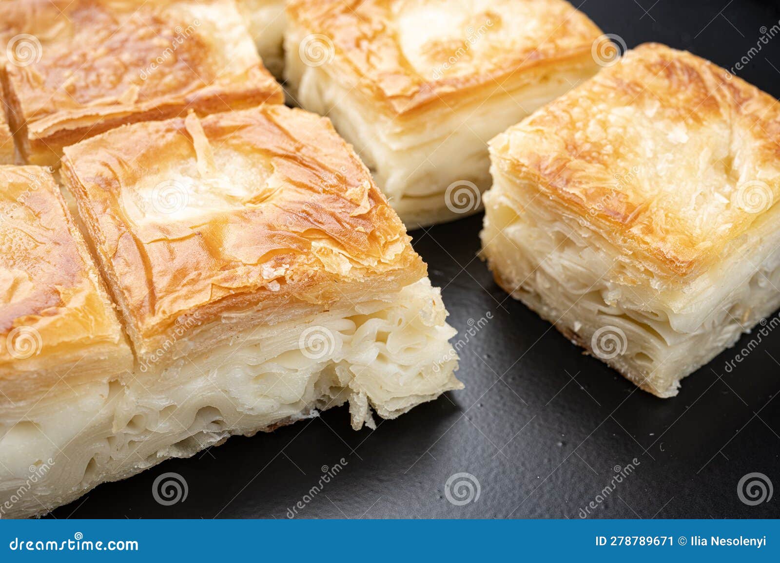 Turkish Su Boregi Burek with Paynir, on Black Dark Stone Table ...