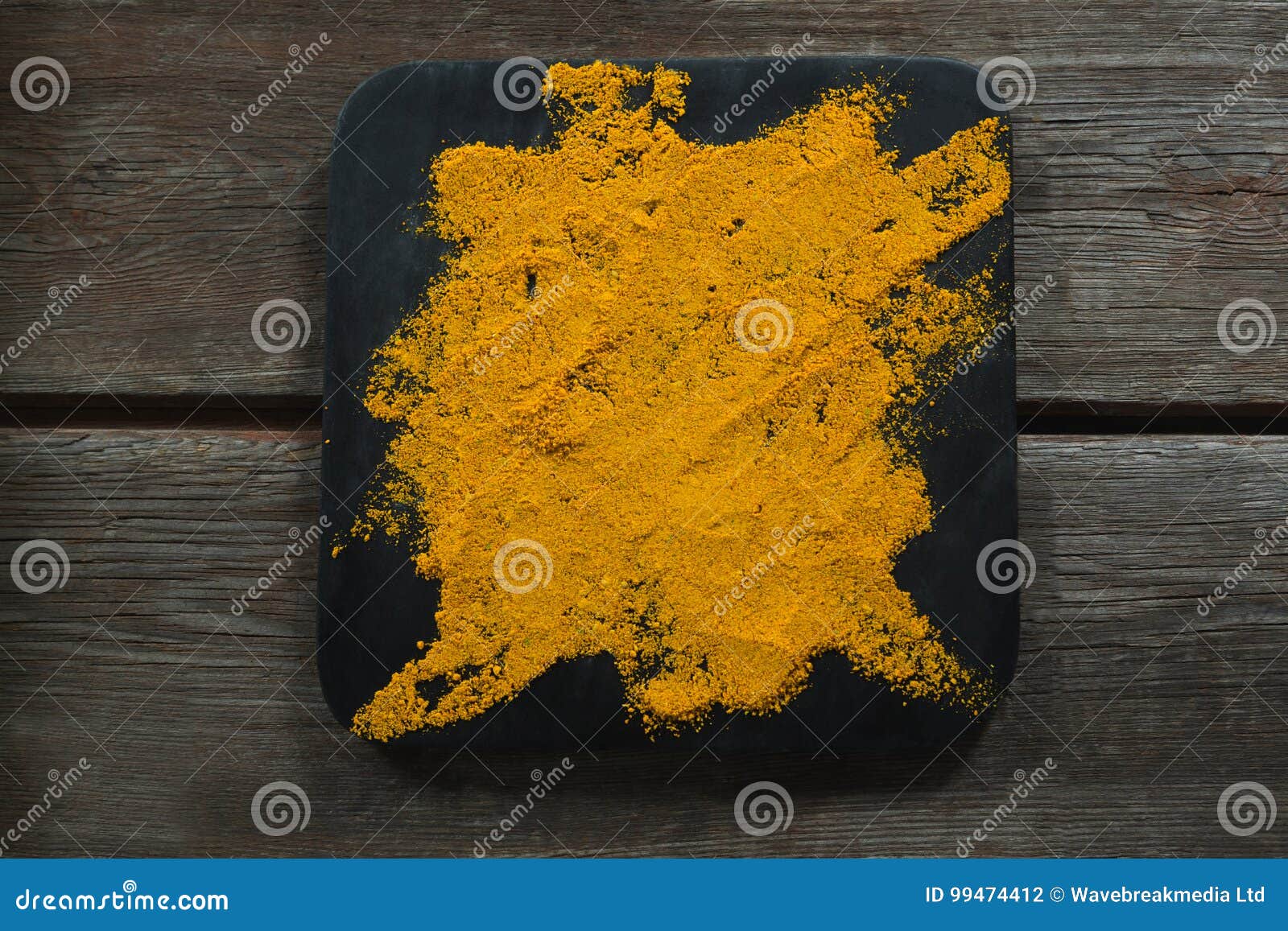 Turmeric powder on board stock photo. Image of recipe - 99474412