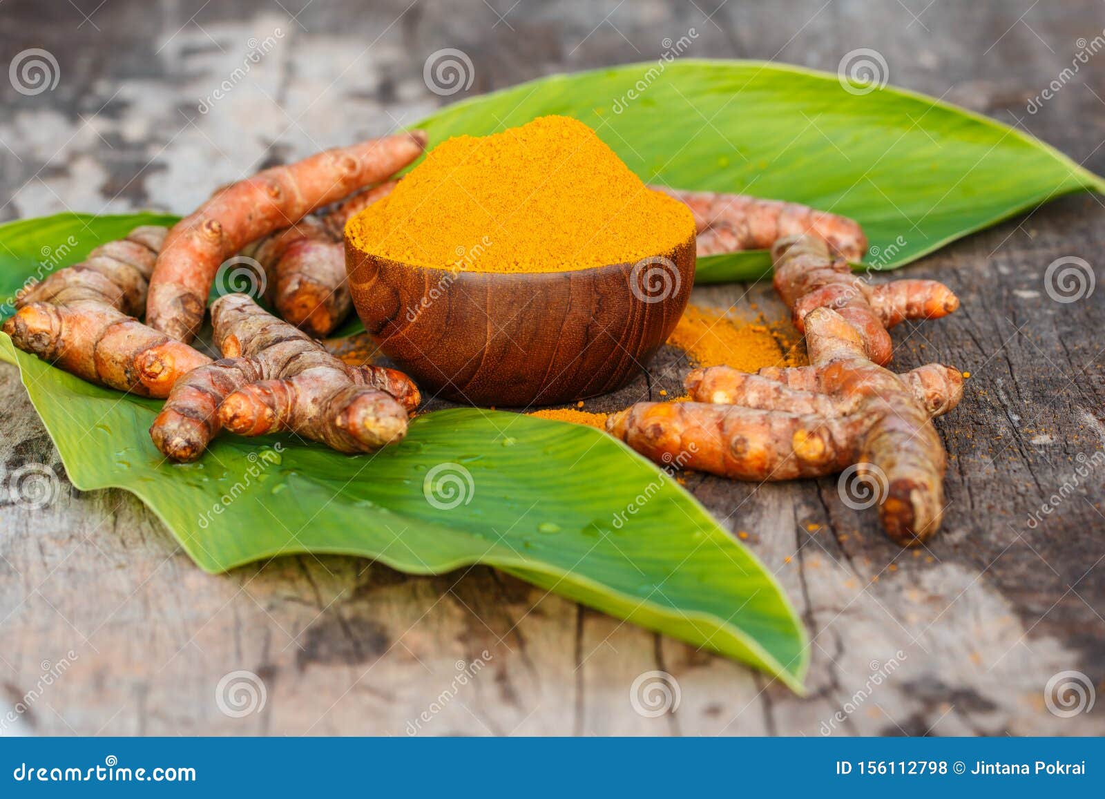 Turmeric Powder in Wooden Bowls on Wooden Table Stock Photo - Image of ...