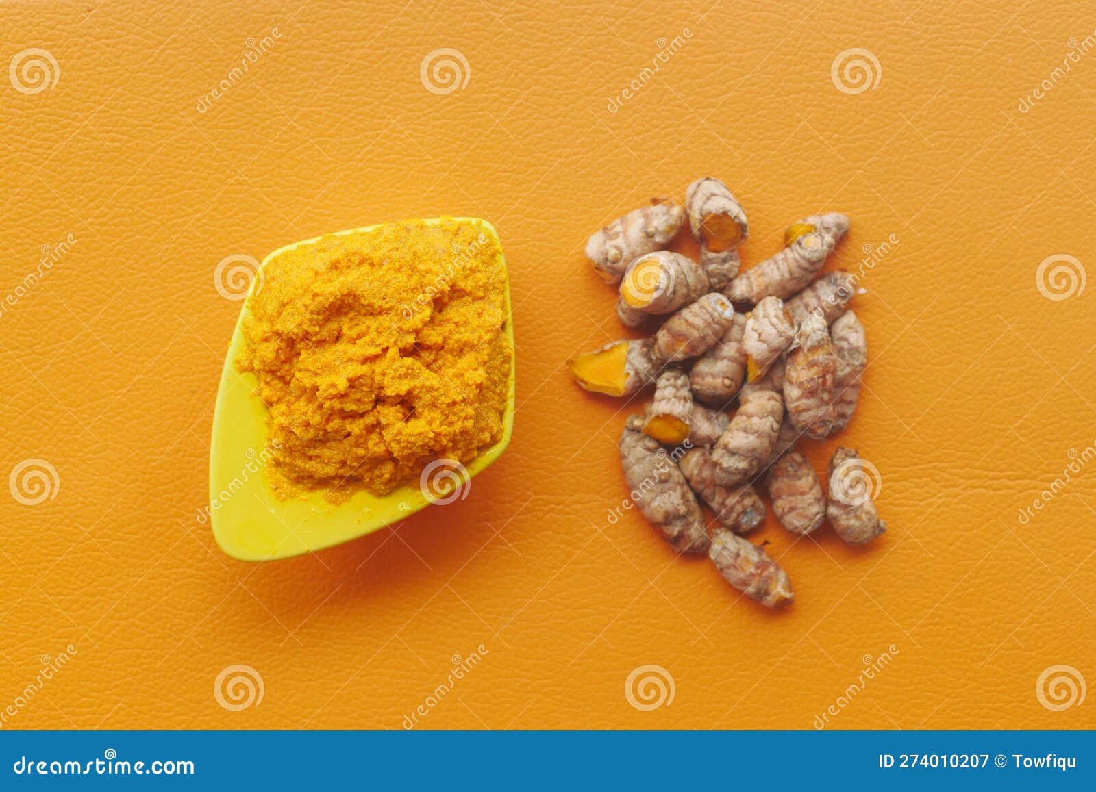 Turmeric Root and Paste in a Bowl on Orange Background Stock Image ...