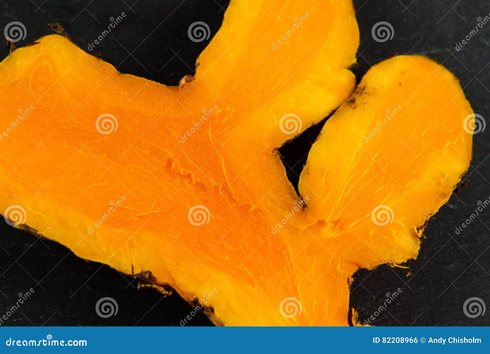 Turmeric Root Sliced Open on Dark Slate Background Stock Photo - Image ...