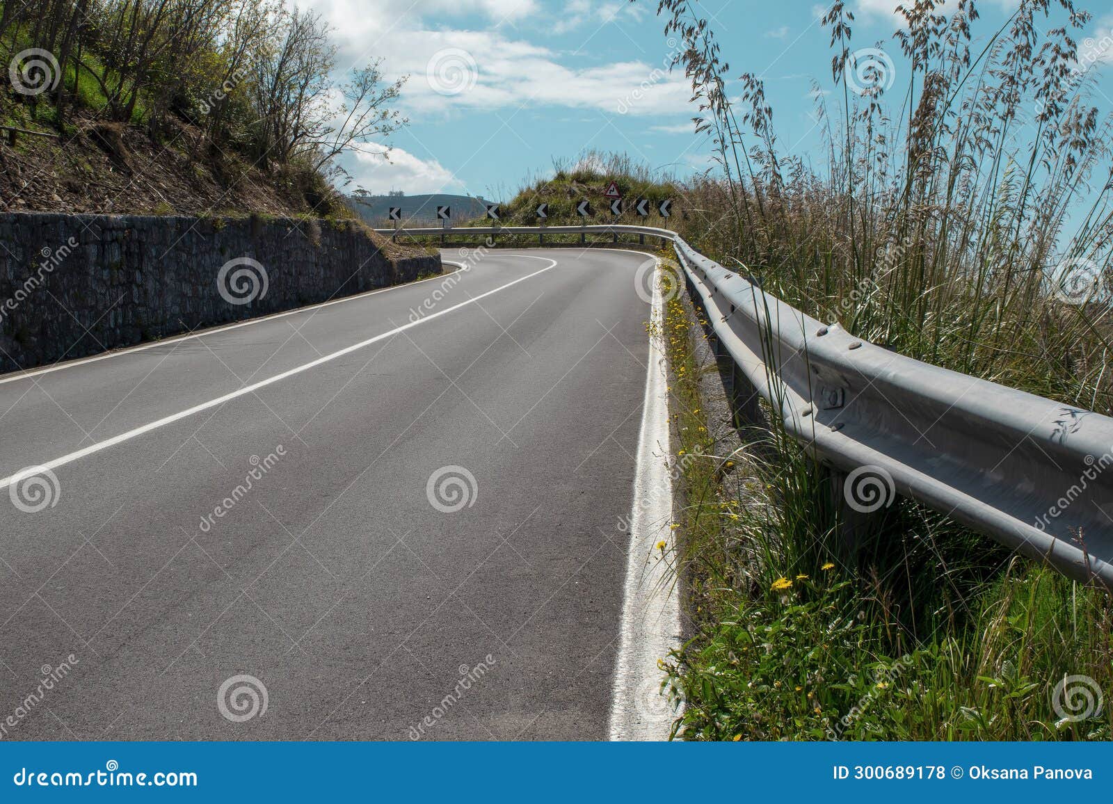A Turn in a Mountainous Landscape. Sharp Turns, Be Careful on the Road ...