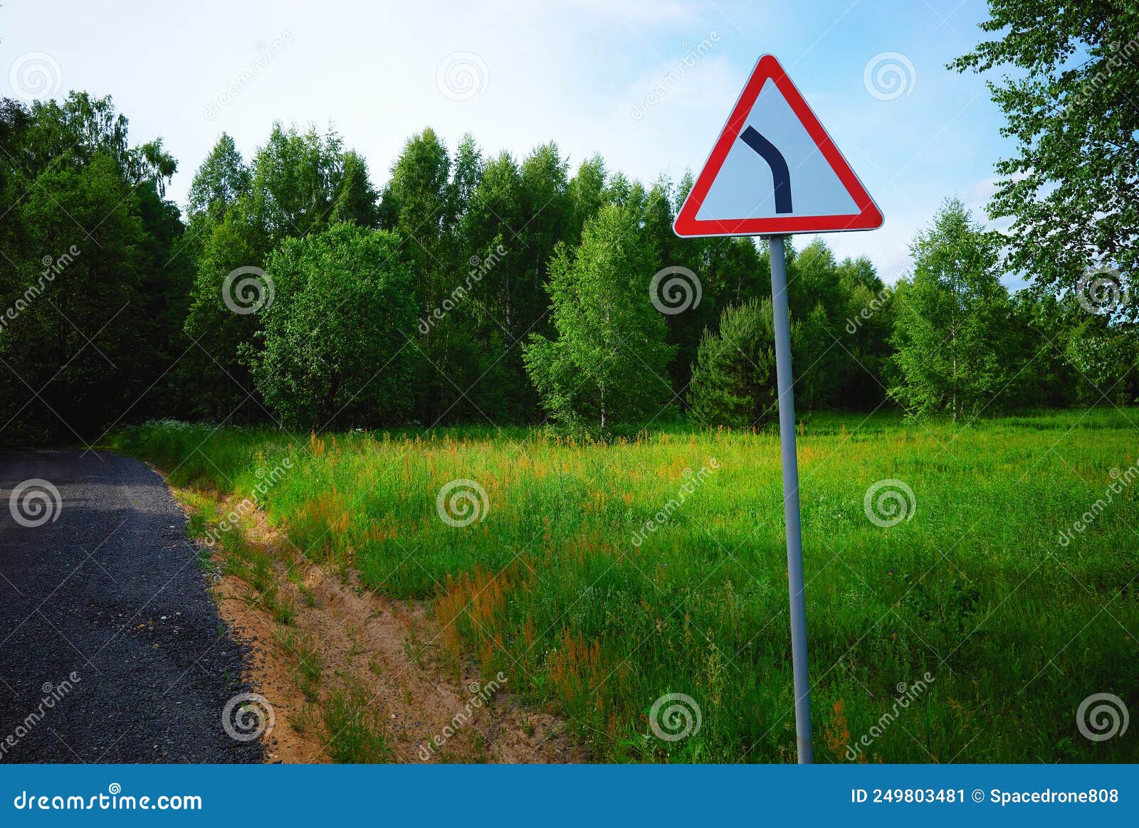 Turn Sign on Countryside Road Background Stock Image - Image of green ...