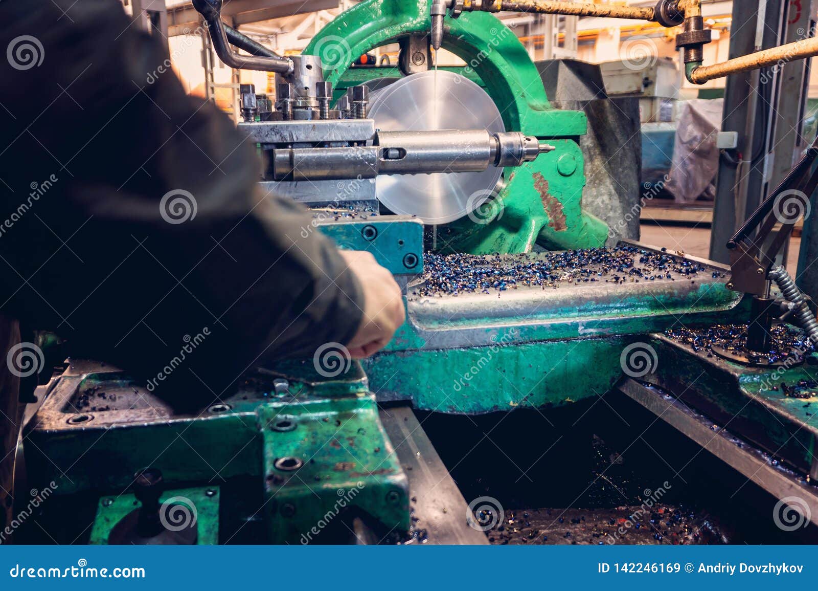 Turner Worker Manages The Metalworking Process Of Mechanical Cutting On ...