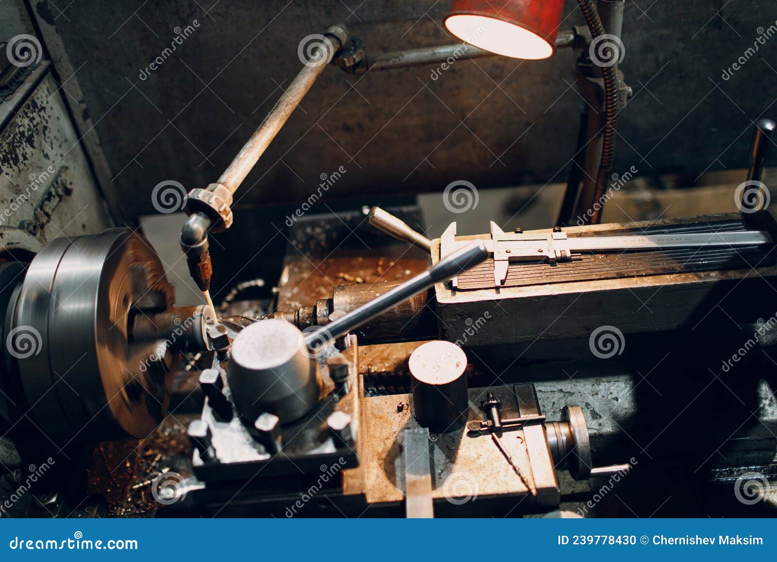 Turner Worker Manages The Metalworking Process Of Mechanical Cutting On ...