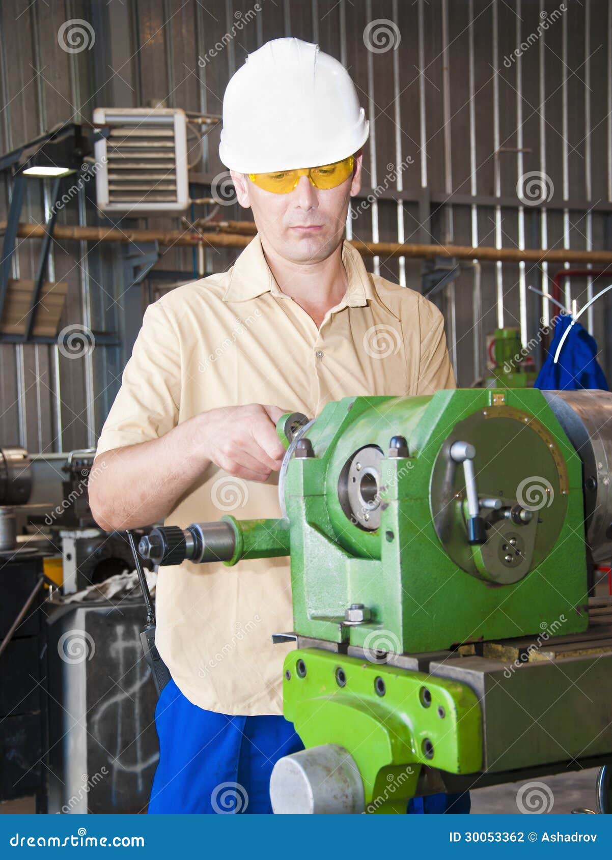 The Mechanic Works at the Lathe at Factory Stock Photo - Image of ...