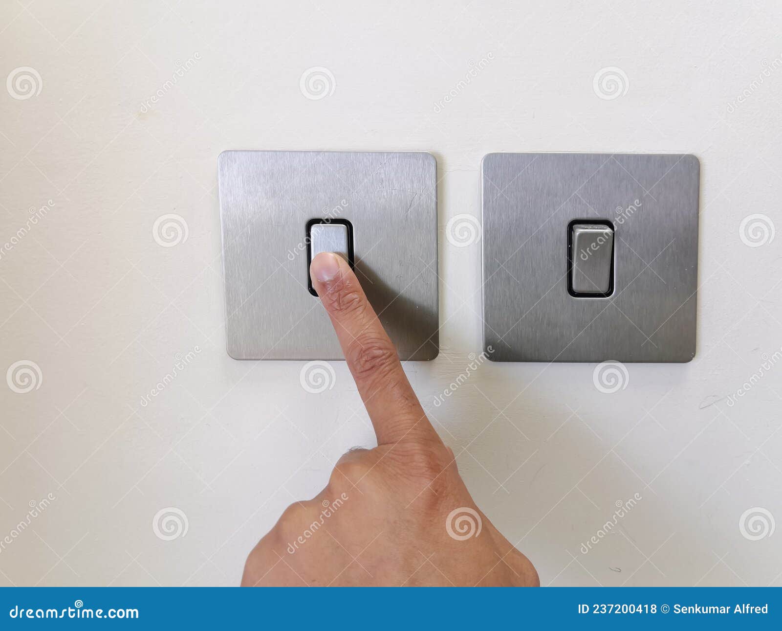 Turning on Modern Electric Switch with Finger. Selective Focus Stock ...