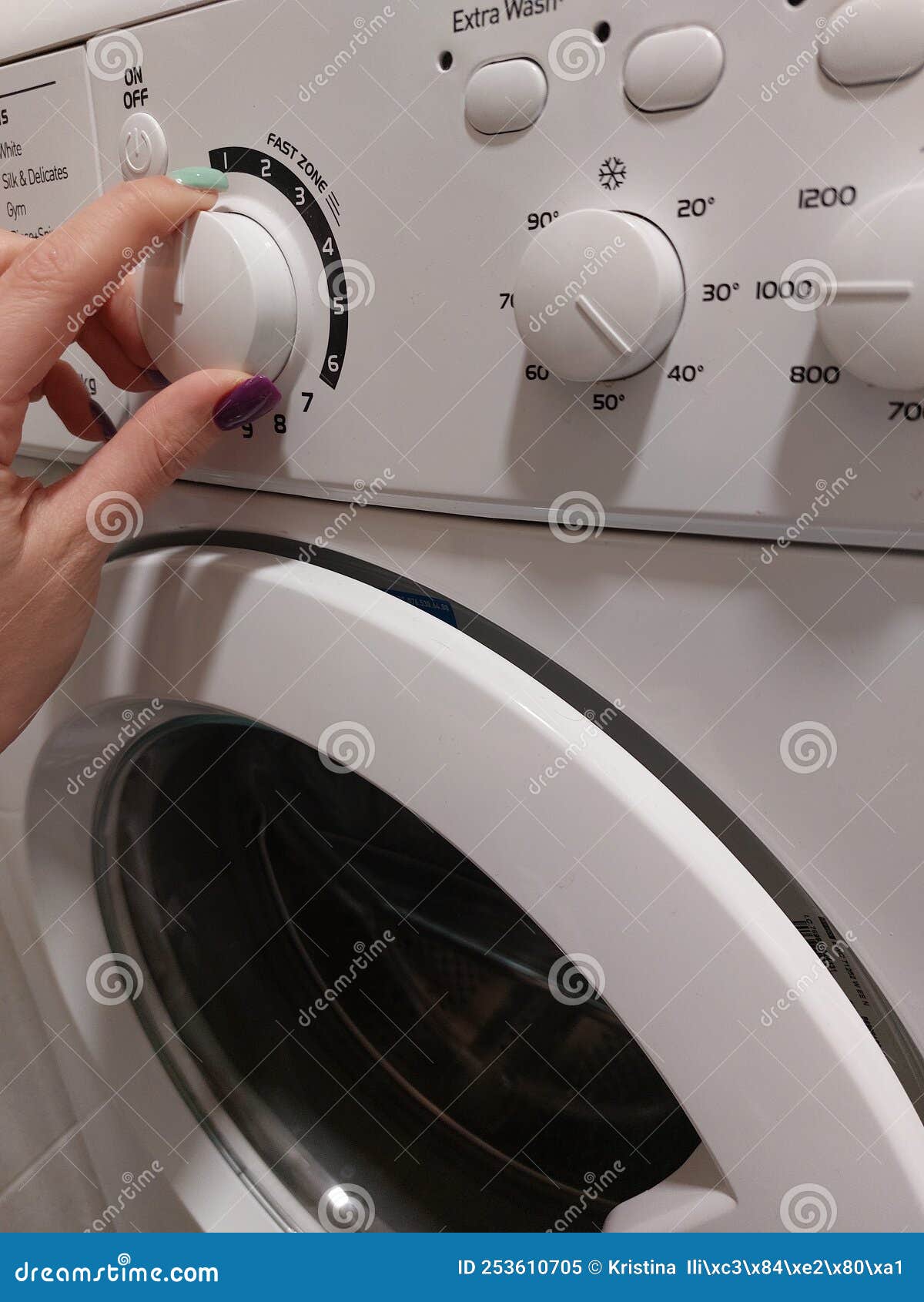 Turning on washing mashine stock image. Image of glass - 253610705