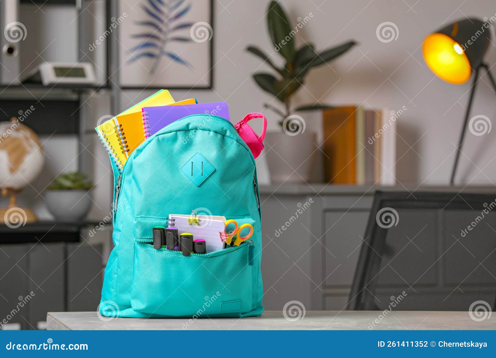Turquoise Backpack with Different School Stationery on Table Indoors ...
