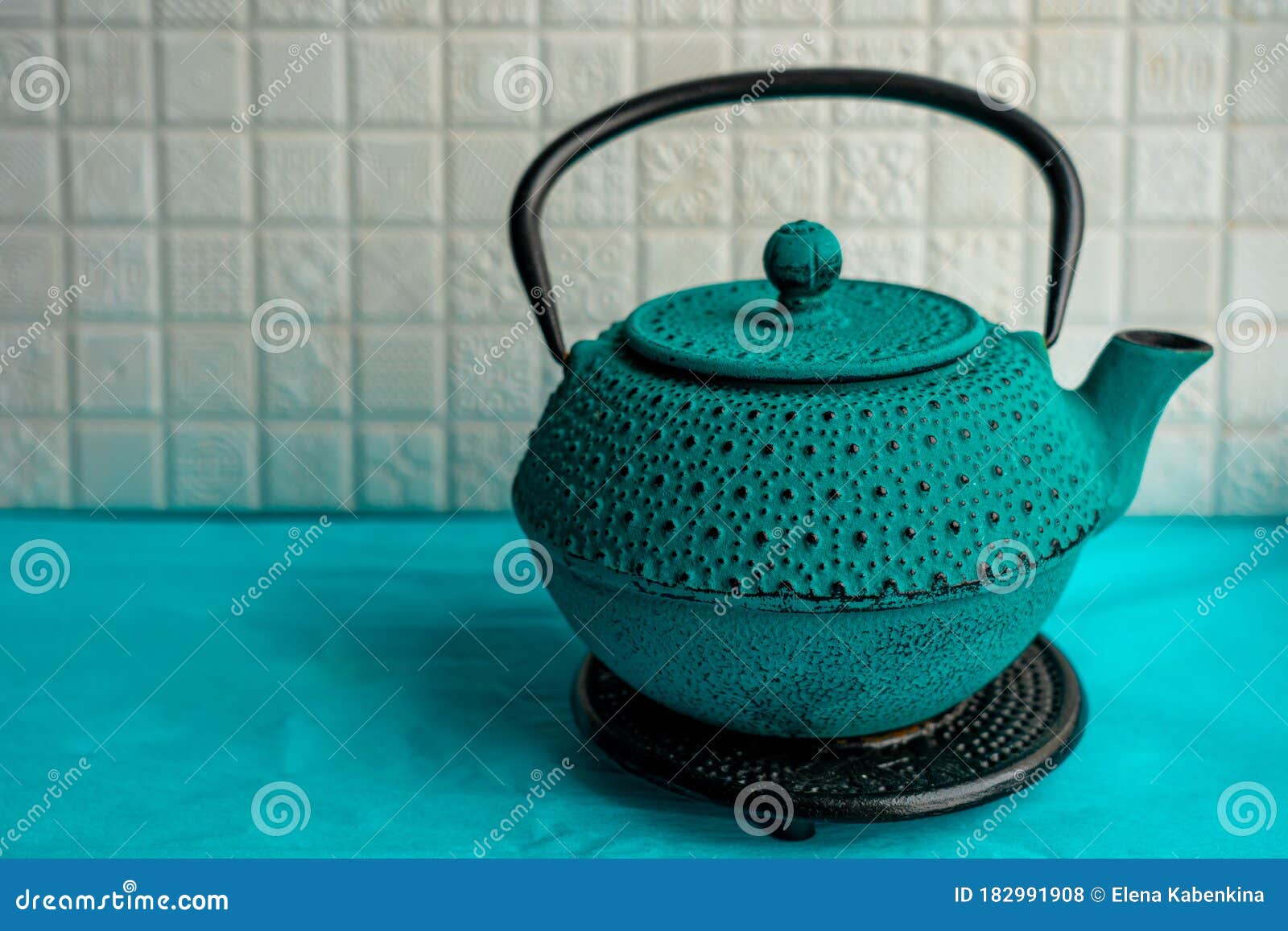 Turquoise Cast-iron Teapot Which is Standing on Turquoise Surface Stock ...