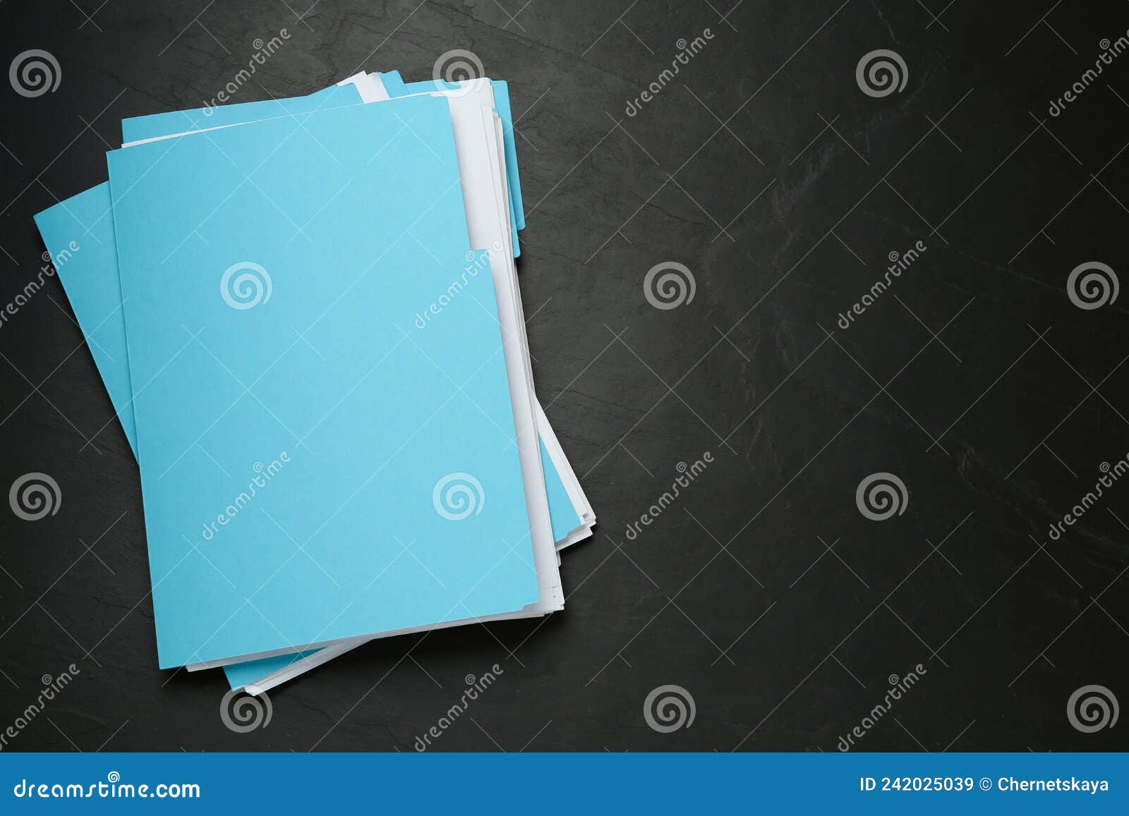 Turquoise Files with Documents on Black Slate Table, Top View. Space ...
