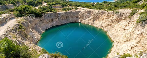Turquoise Lake in a Disused Bauxite Quarry, Framed by Mediterranean ... Turquoise Lake in a Disused Bauxite Quarry, Framed by Mediterranean ...
