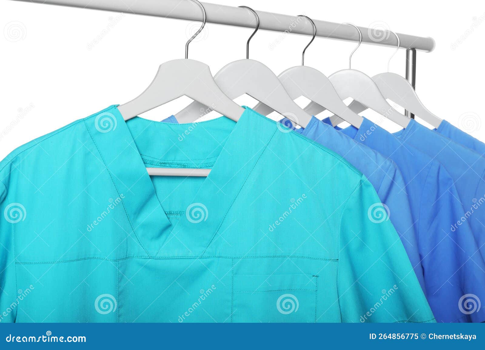 Turquoise and Light Blue Medical Uniforms on Rack Against White ...