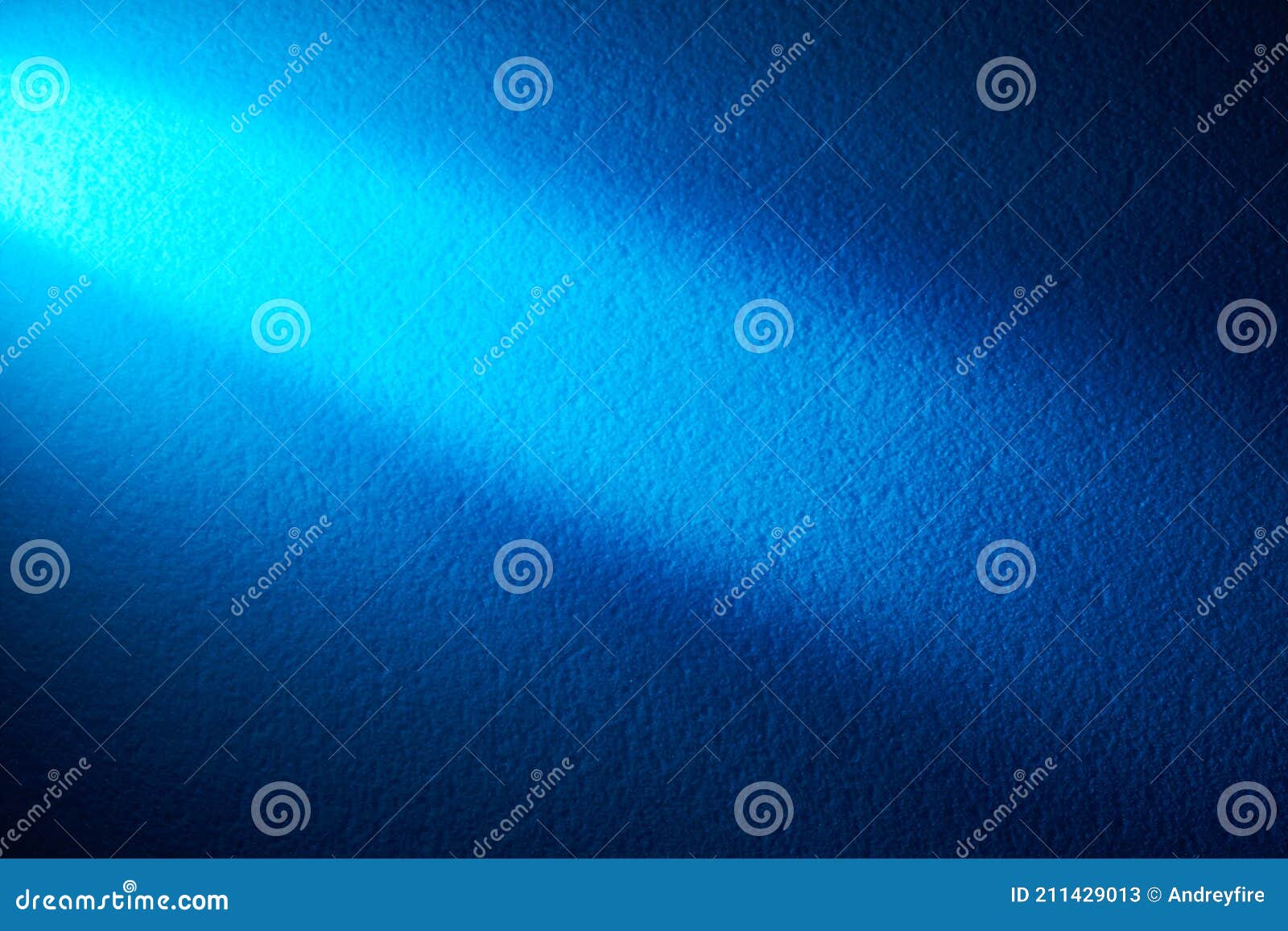 A Turquoise Ray Cuts Diagonally through a Blue Texture Background Stock ...