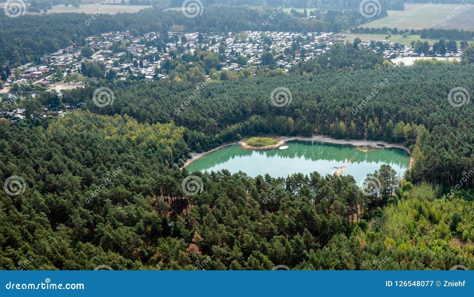 Turquoise Rectangular Lake in a Forest Landscape in Front of a Large ...