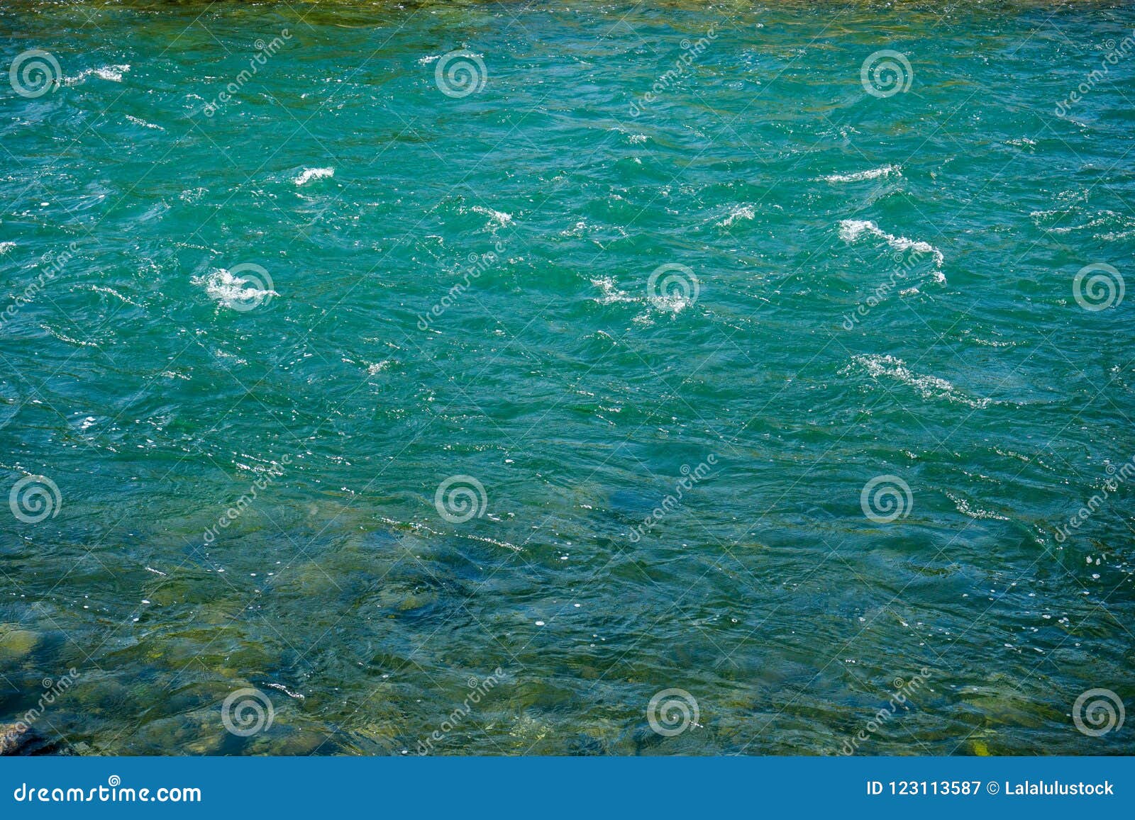 Turquoise River Water with Small Waves and Stones Stock Image - Image ...