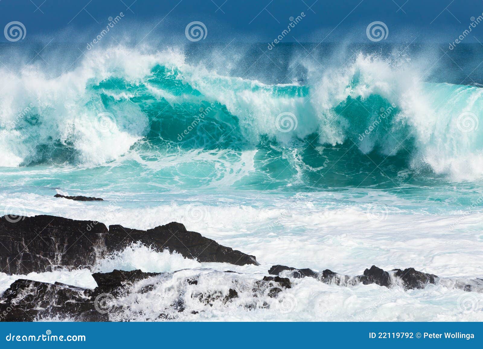 Turquoise Rolling Wave Slaming on the Rocks Stock Photo - Image of ...