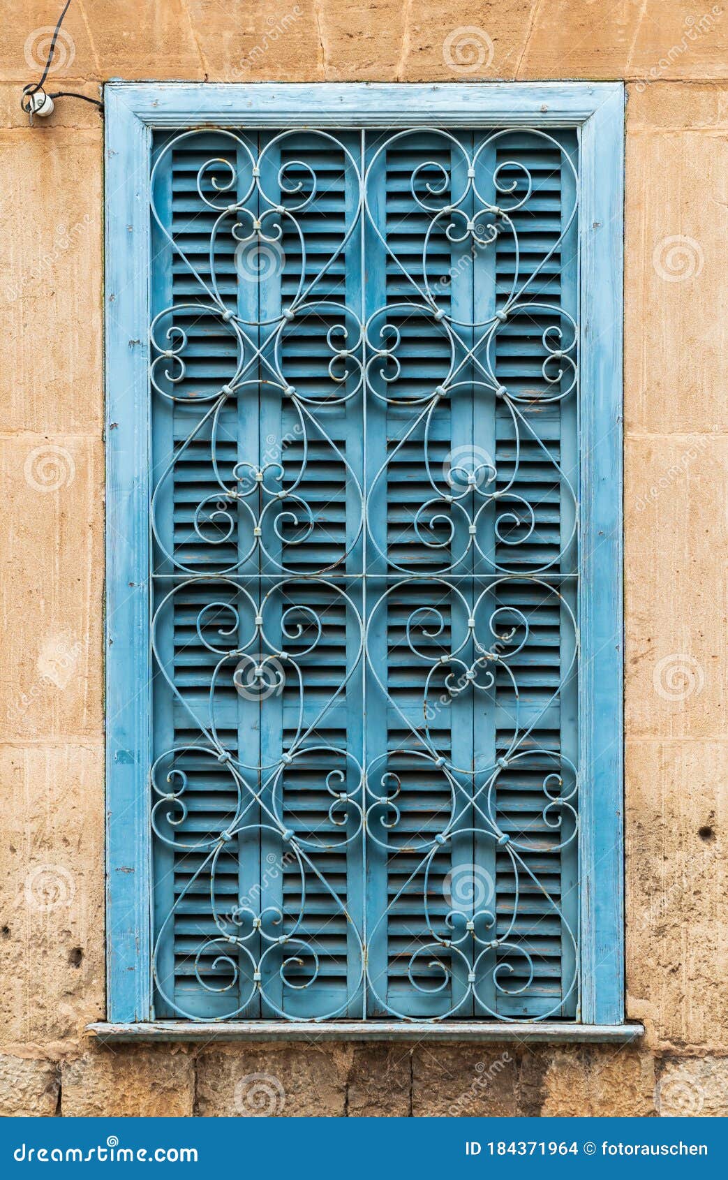 Close-up of Turquoise Window Shutters with Heart-shaped Window Grating ...