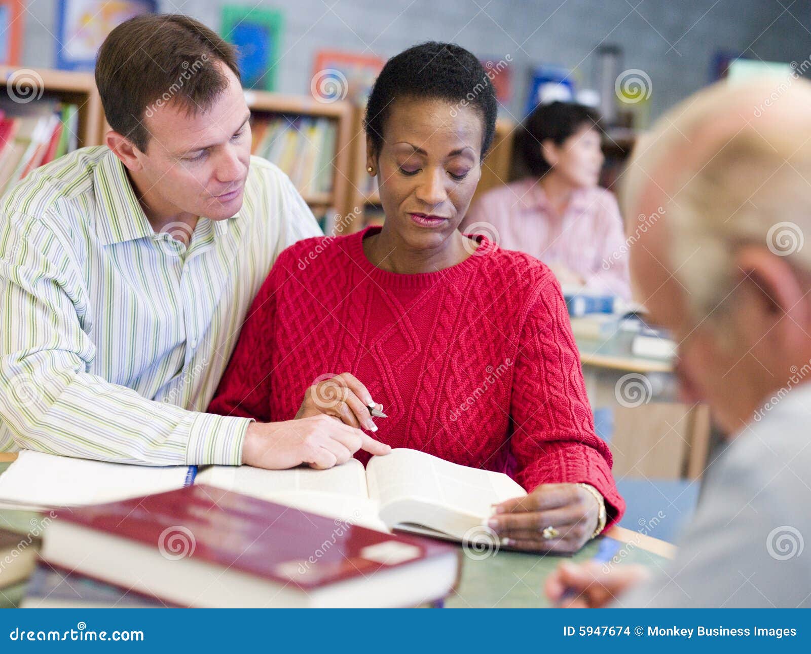 Tutor Assisting Mature Student in Library Stock Photo - Image of ... Tutor Assisting Mature Student in Library Stock Photo - Image of ...