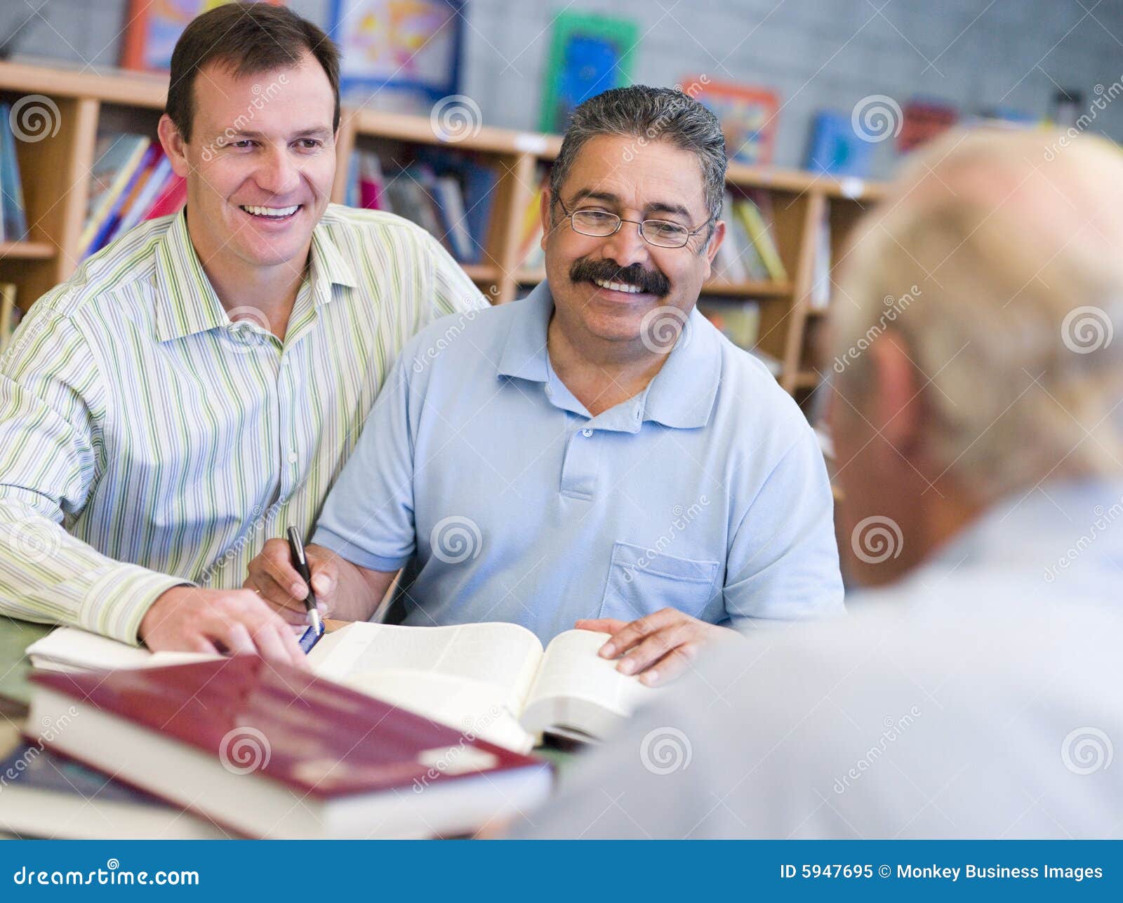 Tutor Assisting Mature Student in Library Stock Image - Image of mature ...