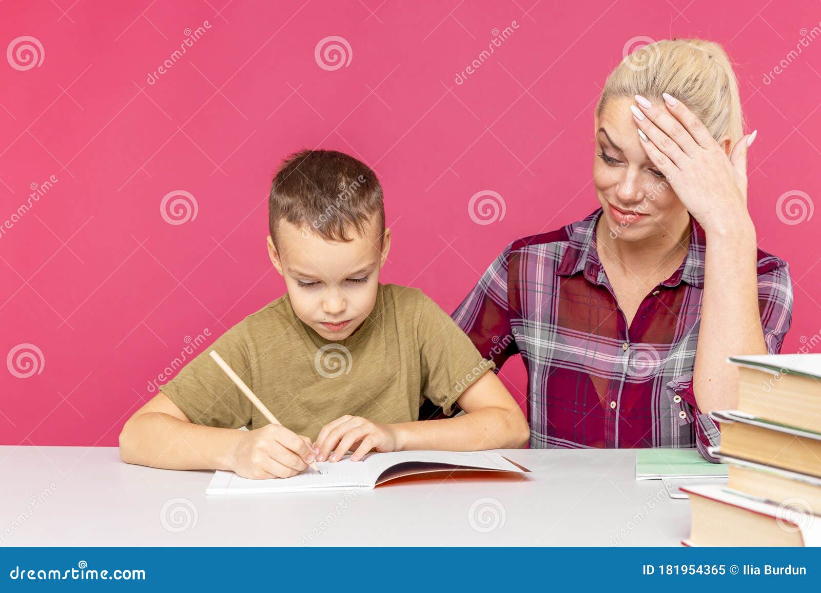 Tutor with Child Doing Homework Together at Home. Stock Image - Image ...