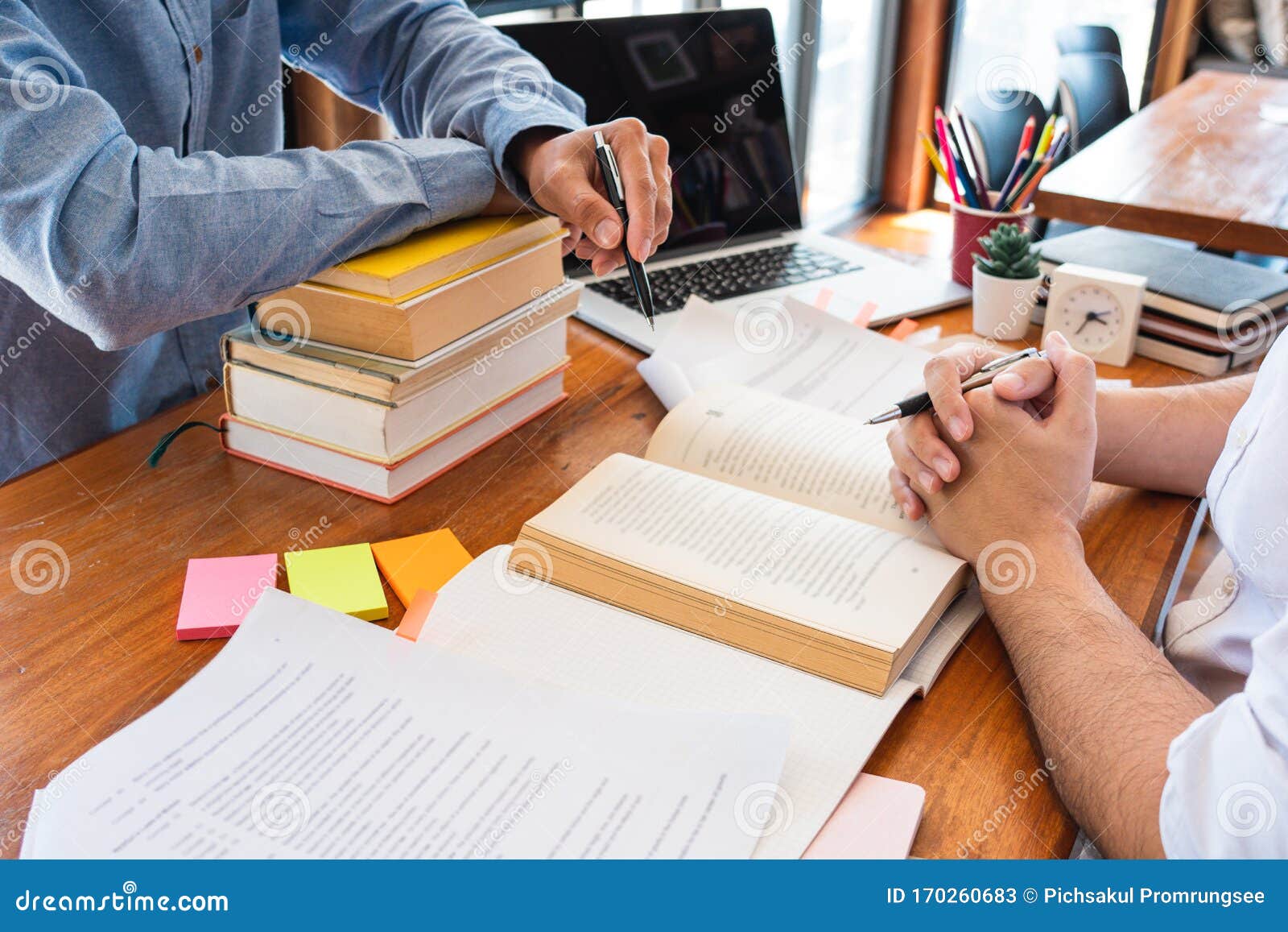 Tutor and College Students Teaching School Work and Explaining Problem ...