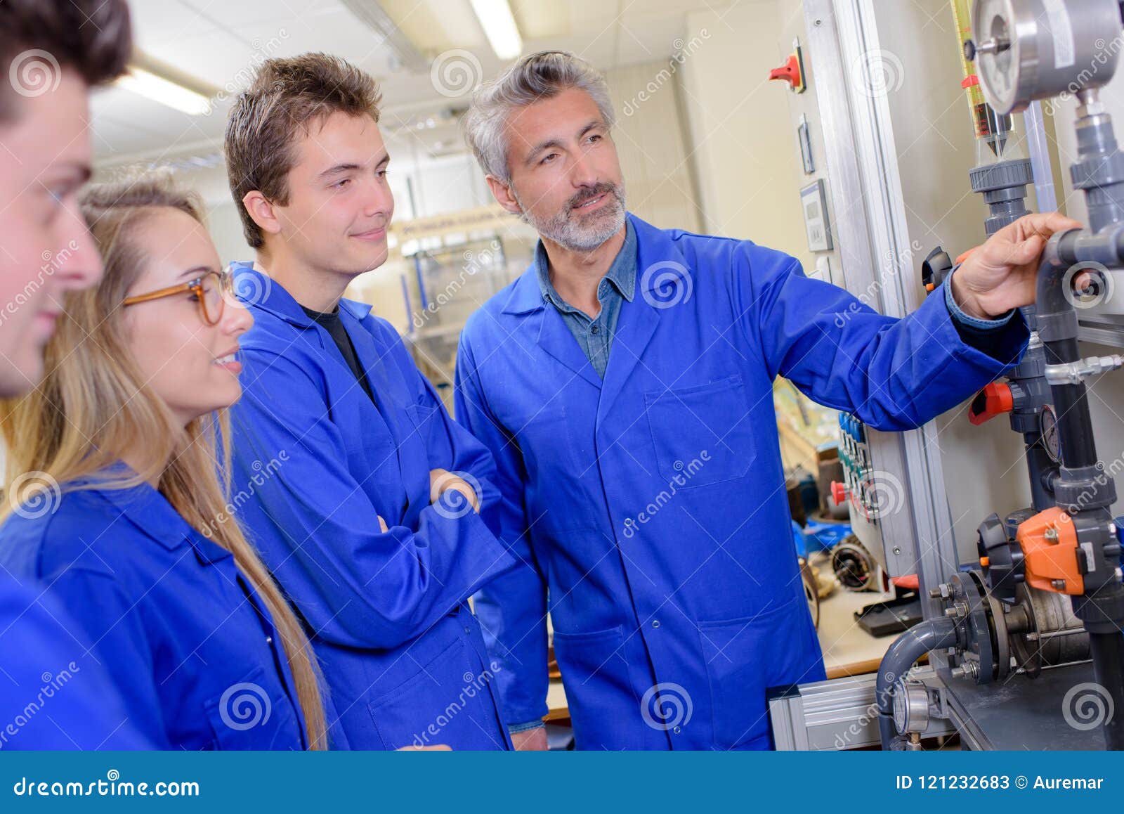 Tutor Explaining Pipework To Students Stock Image - Image of student ...