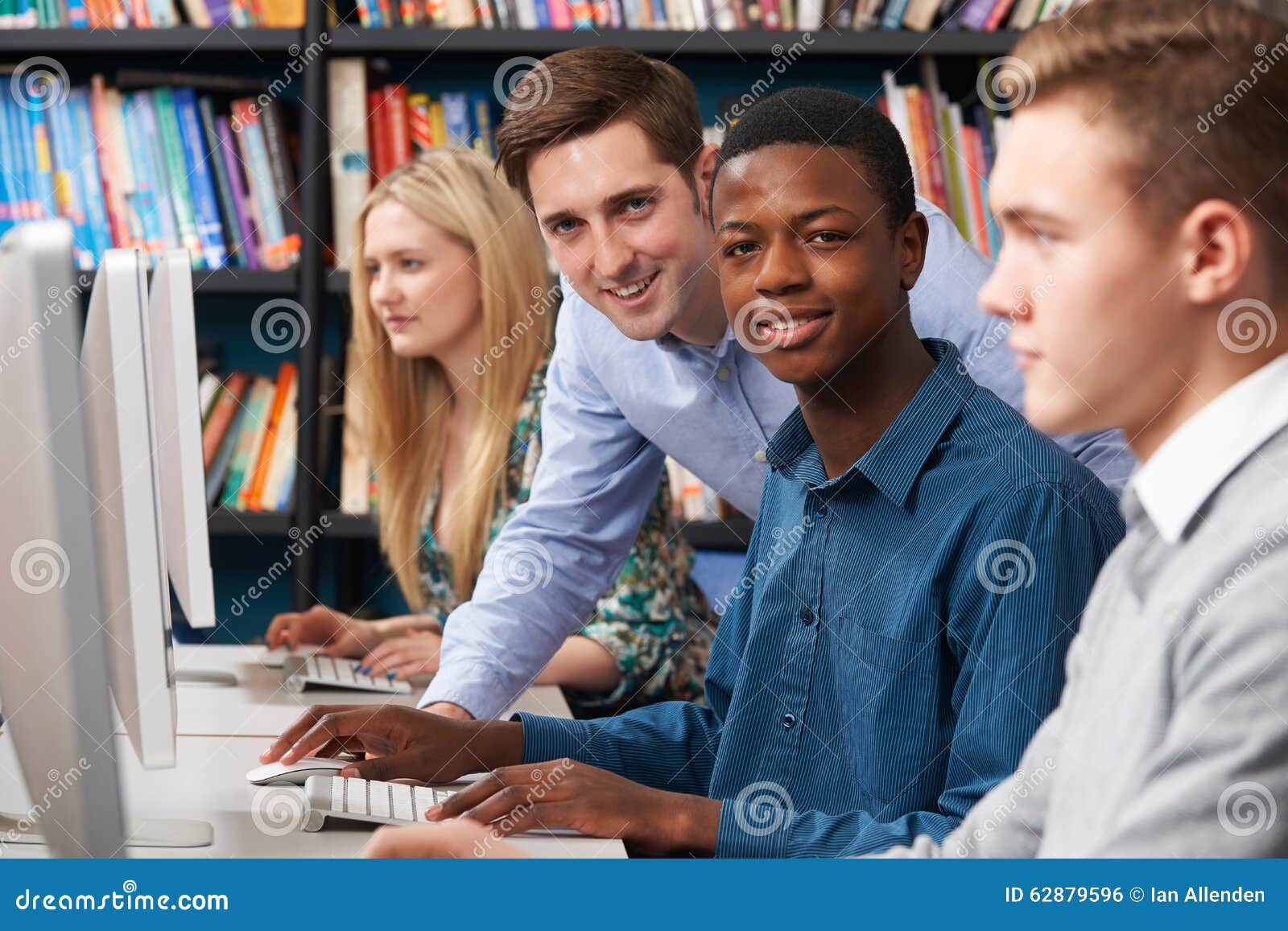 Teenage Students With Laptops Sitting On Stone Steps. Royalty-Free ...