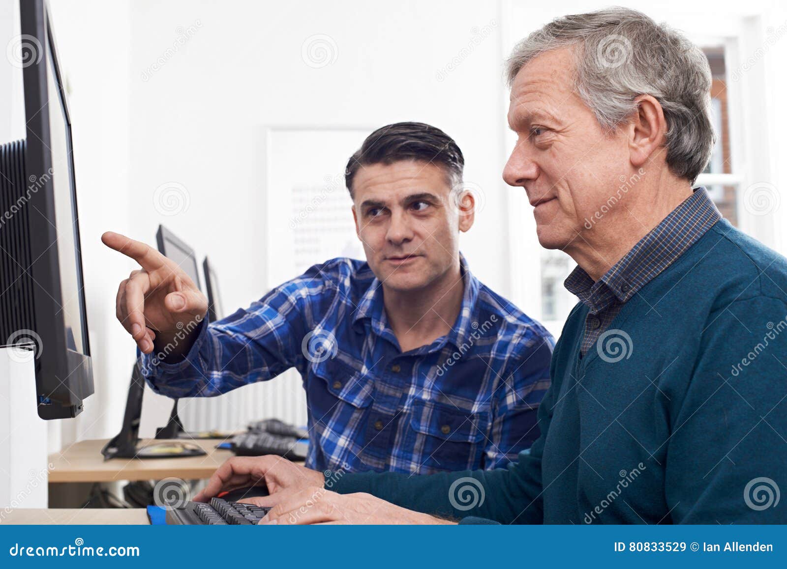 Tutor Helping Mature Man in Computer Class Stock Image - Image of class ...