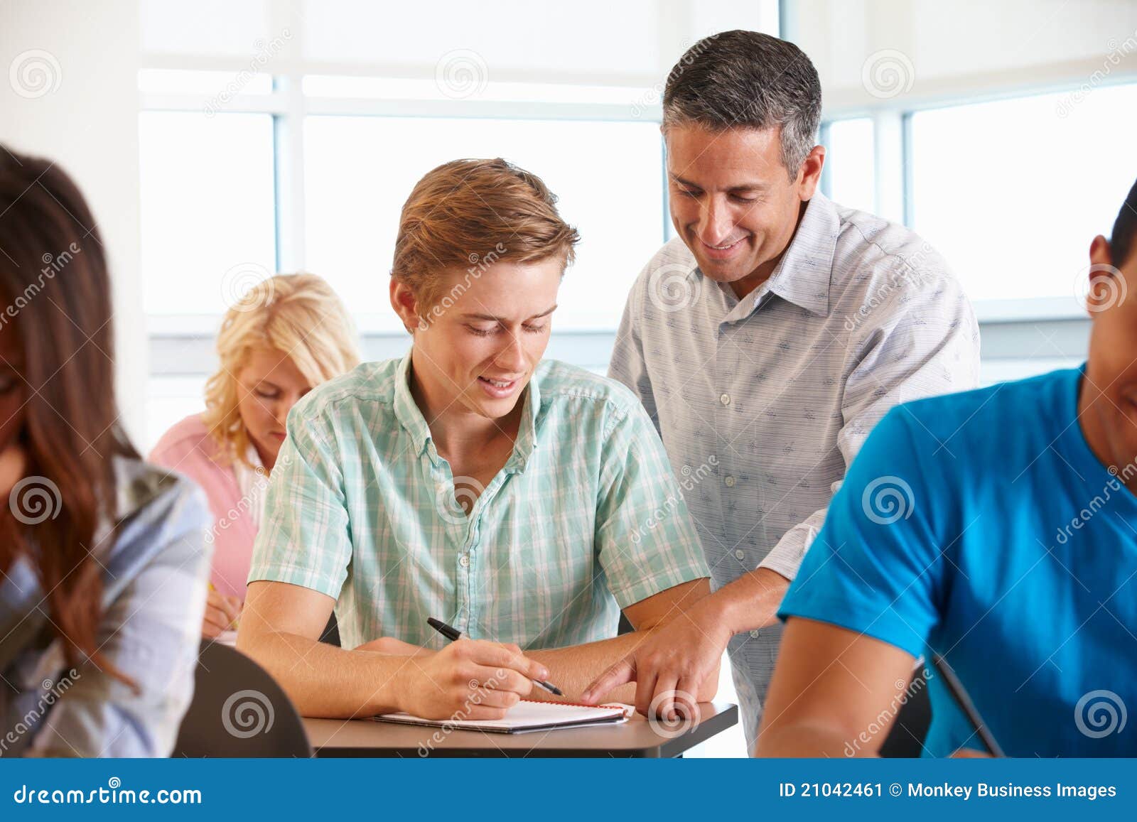 Tutor Helping Student in Class Stock Image - Image of college, mixed ...