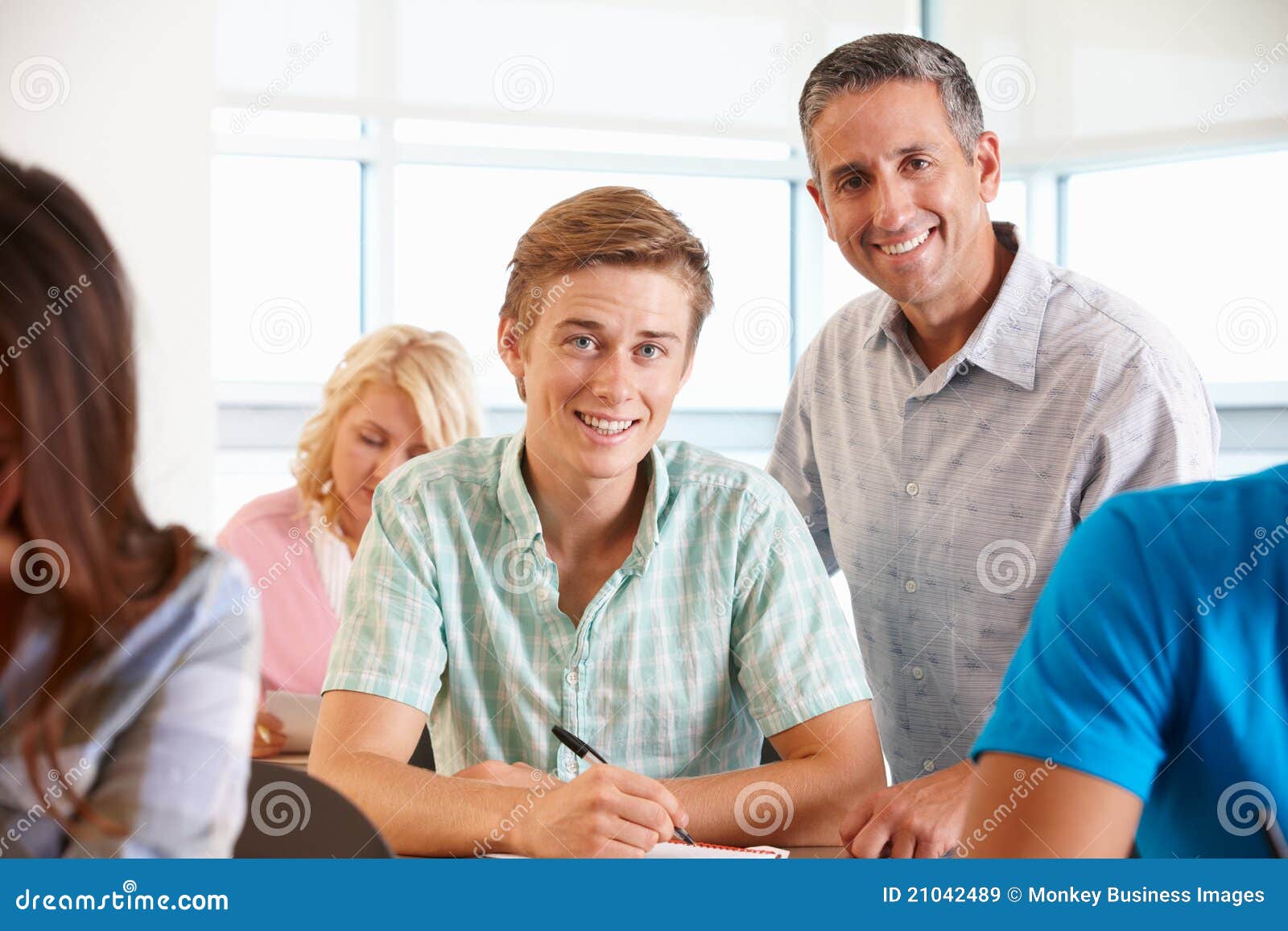 Tutor Helping Student in Class Stock Image - Image of casual, learning ...