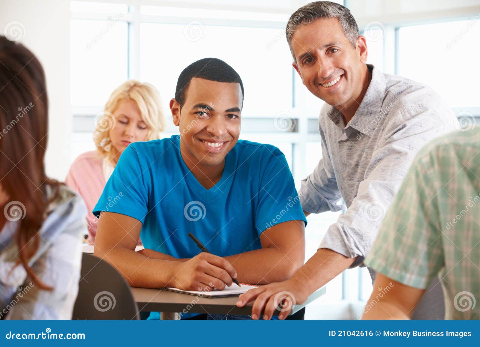 Tutor Helping Student during Class Stock Photo - Image of academic ...