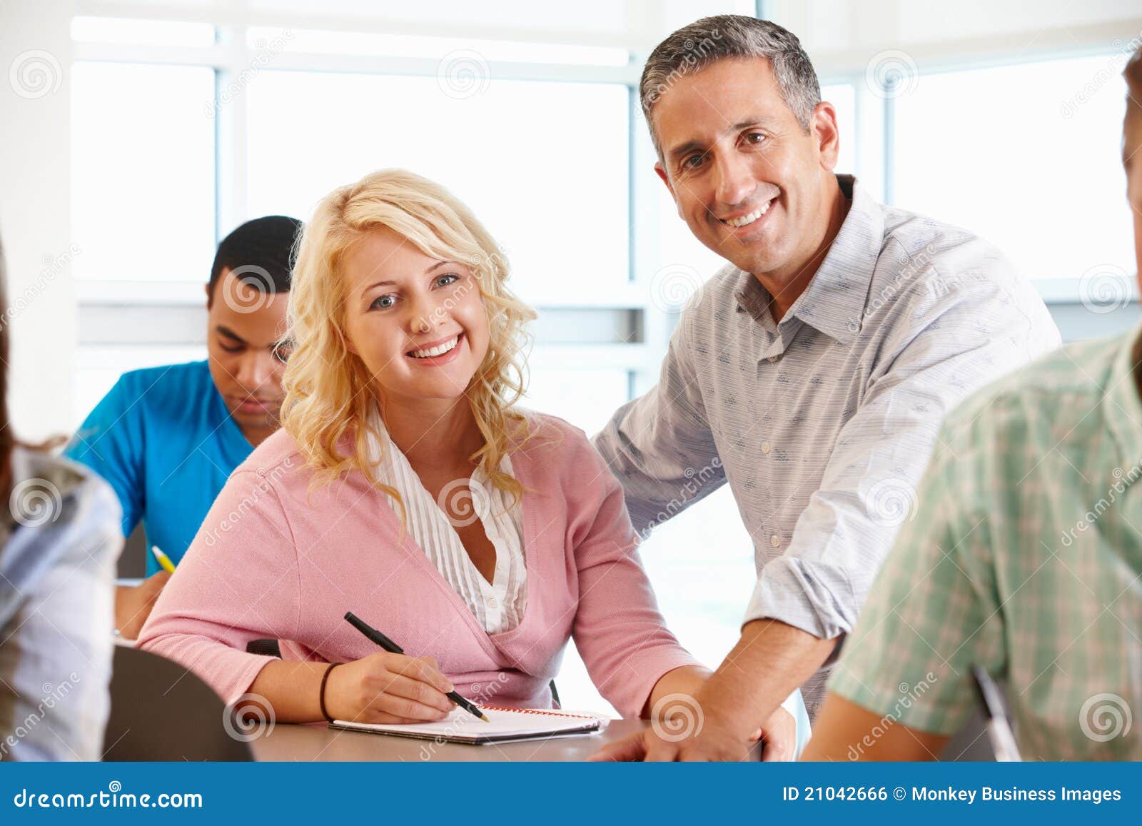 Tutor Helping Student in Class Stock Photo - Image of forties, higher ...