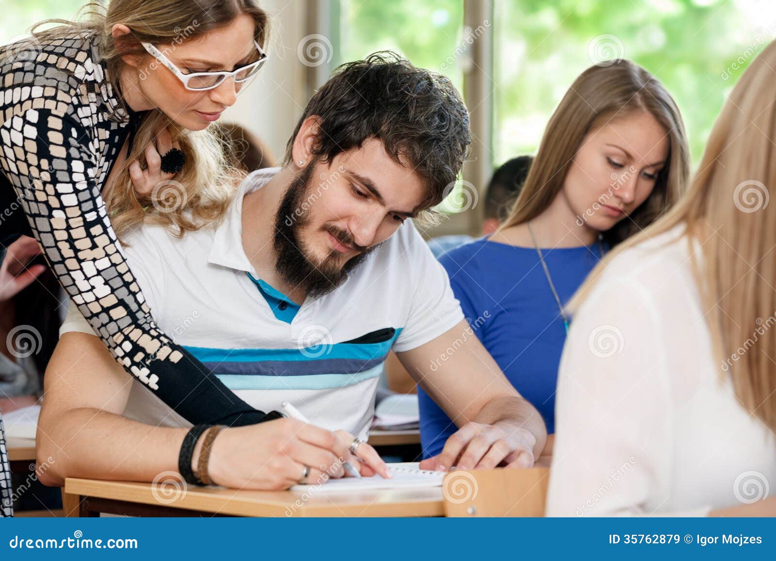 Tutor Helping Student in Class Stock Image - Image of education ...