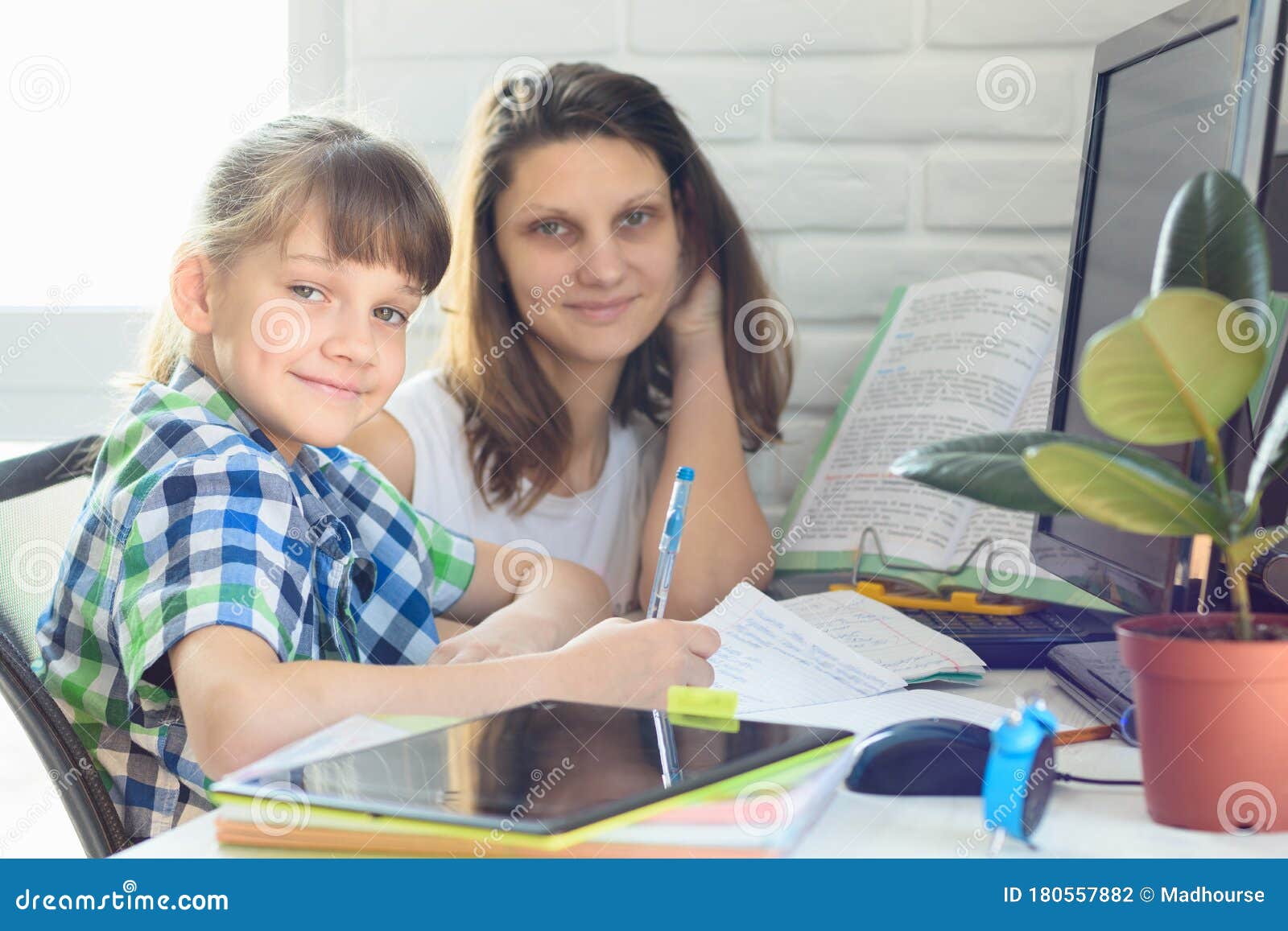 Tutor Helps the Student with Homework on the Computer Stock Photo ...