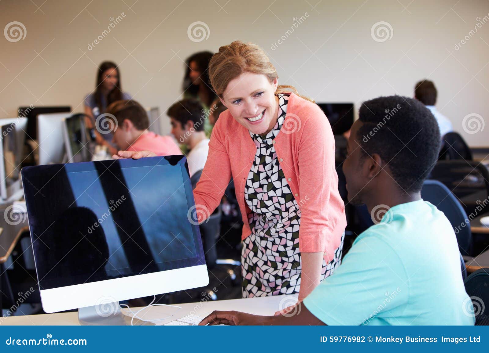 Tutor with Male College Student in Computer Class Stock Photo - Image ...
