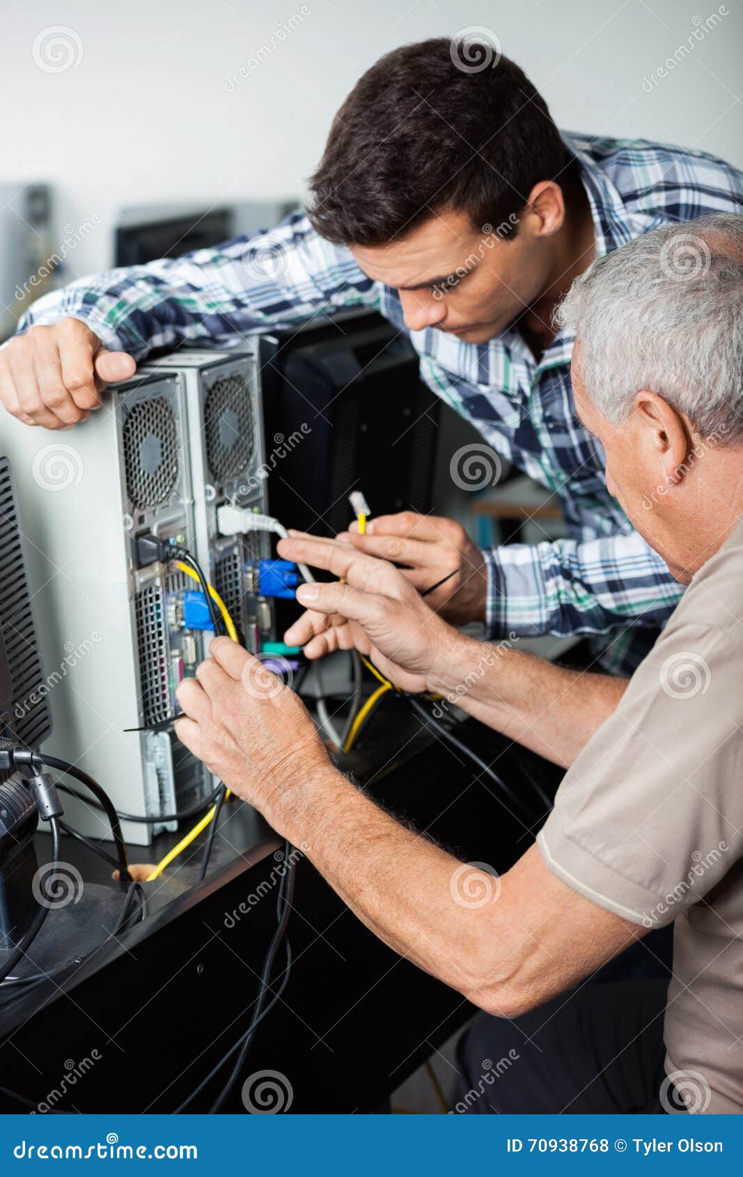 Tutor and Senior Student Fixing Computer in Class Stock Photo - Image ...