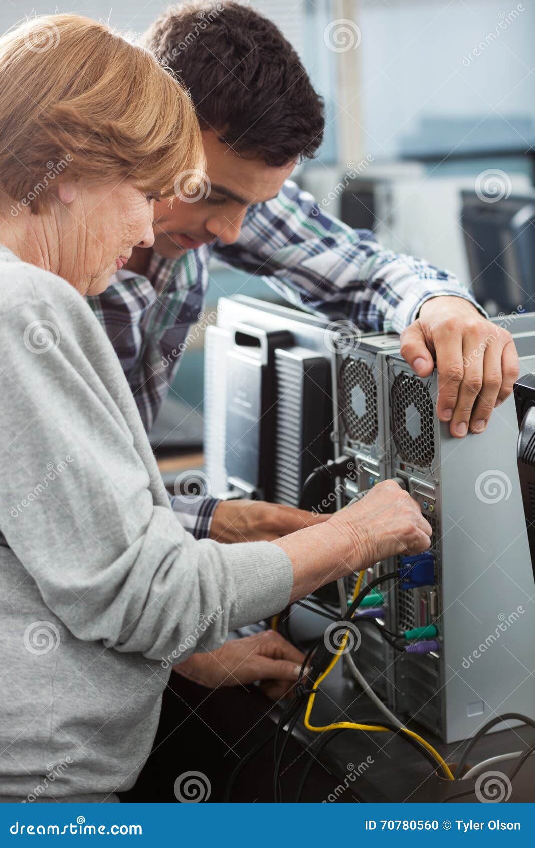 Tutor and Senior Student Fixing Computer in Class Stock Photo - Image ...