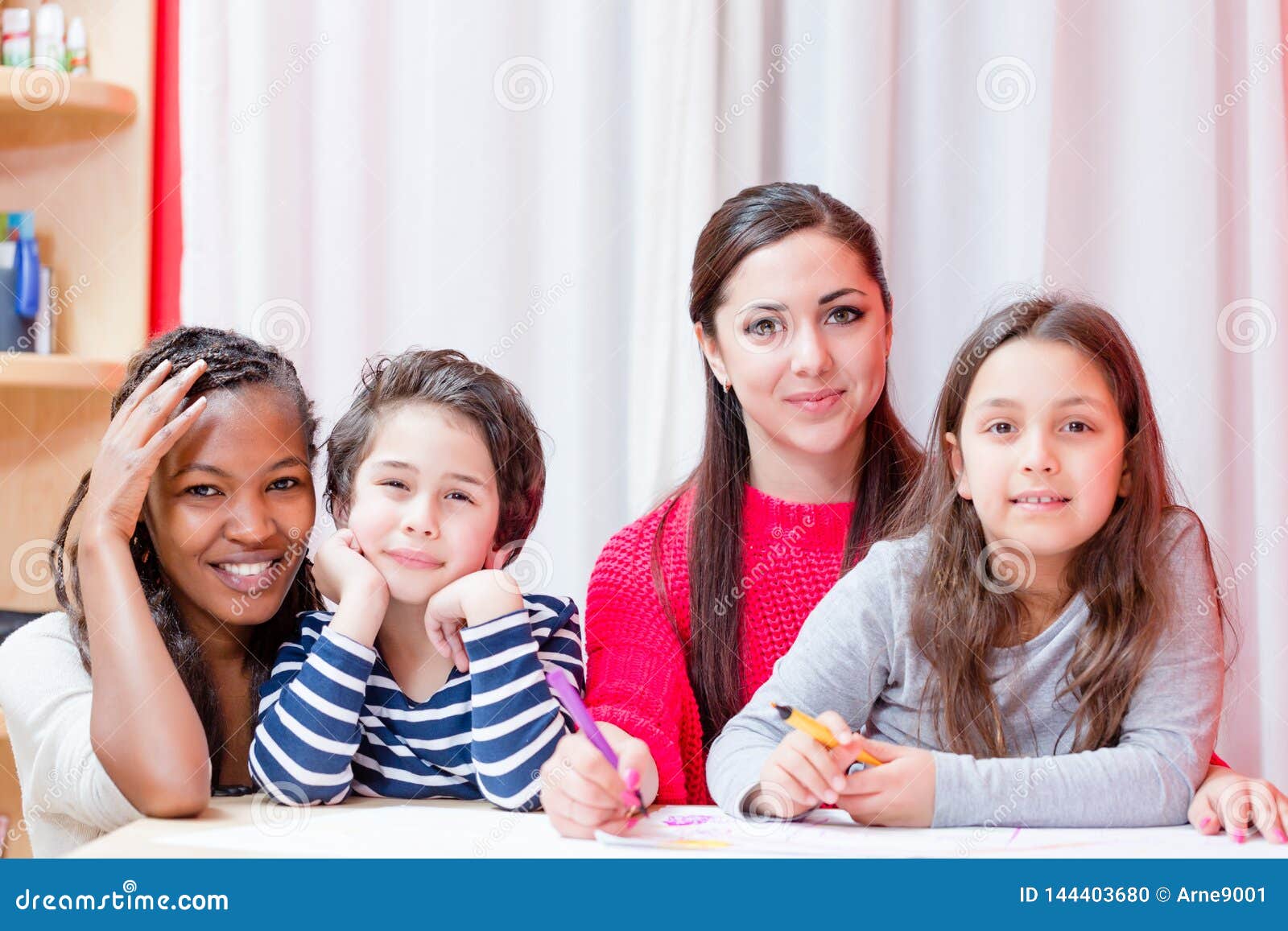 Tutor with Smiling Children Stock Photo - Image of home, child: 144403680