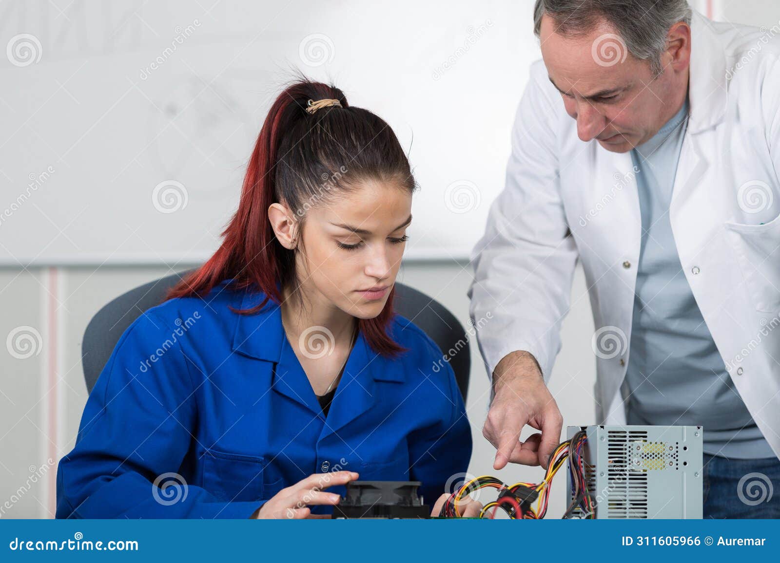 Tutor and Student Fixing Computer in Class Stock Photo - Image of ...